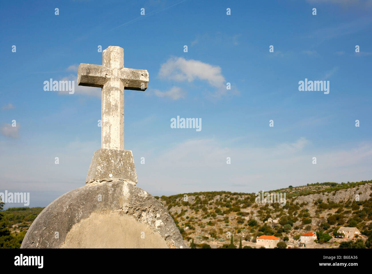 white stone cross on blue sky and cloudy background Stock Photo - Alamy