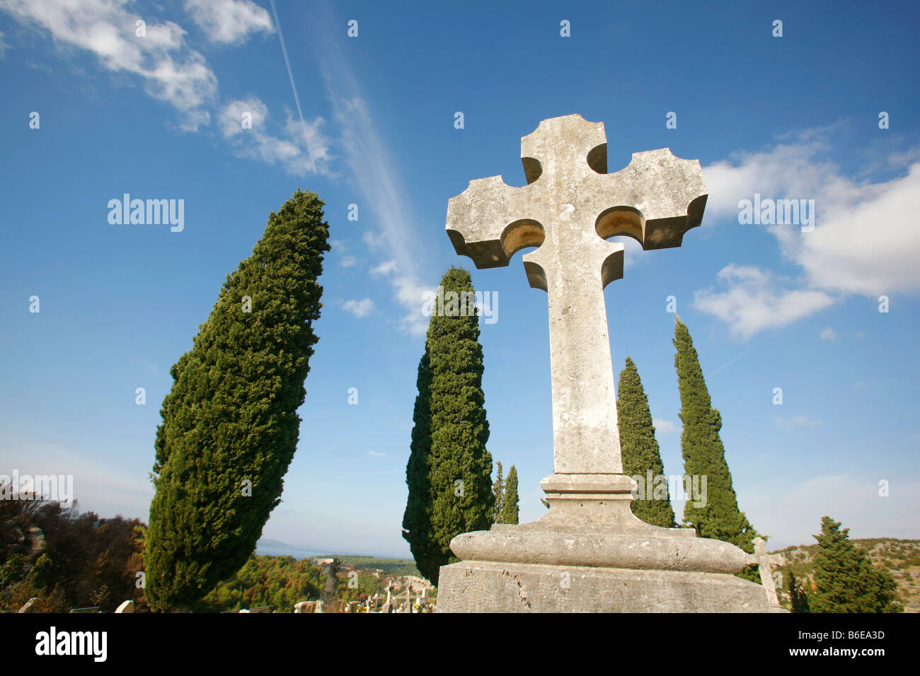 tombstone crosses on blue mediterranean sky with cypresses Stock Photo ...