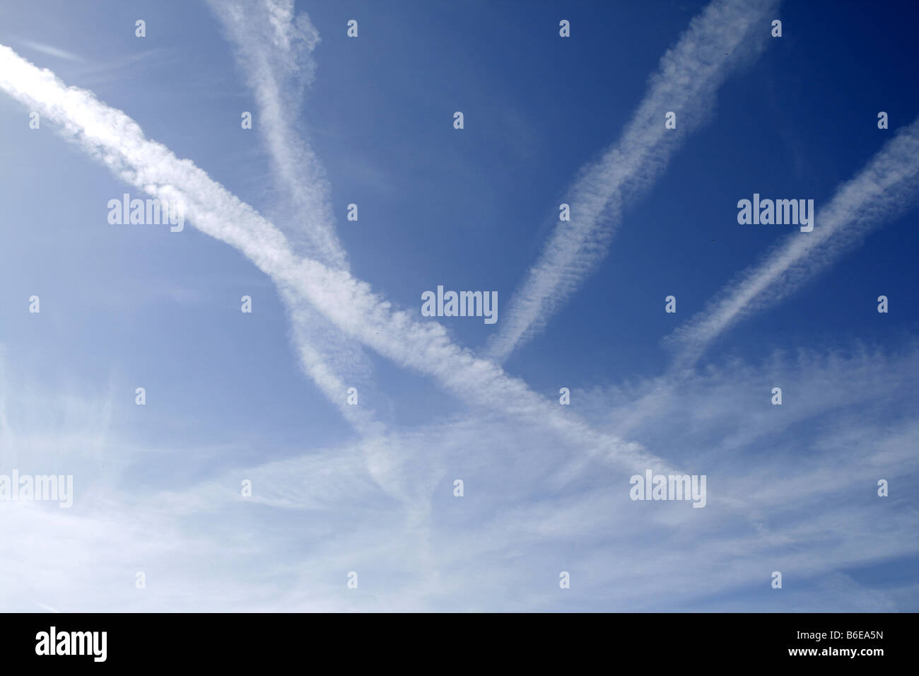 unusual crossing cloud formation in countryside Stock Photo - Alamy