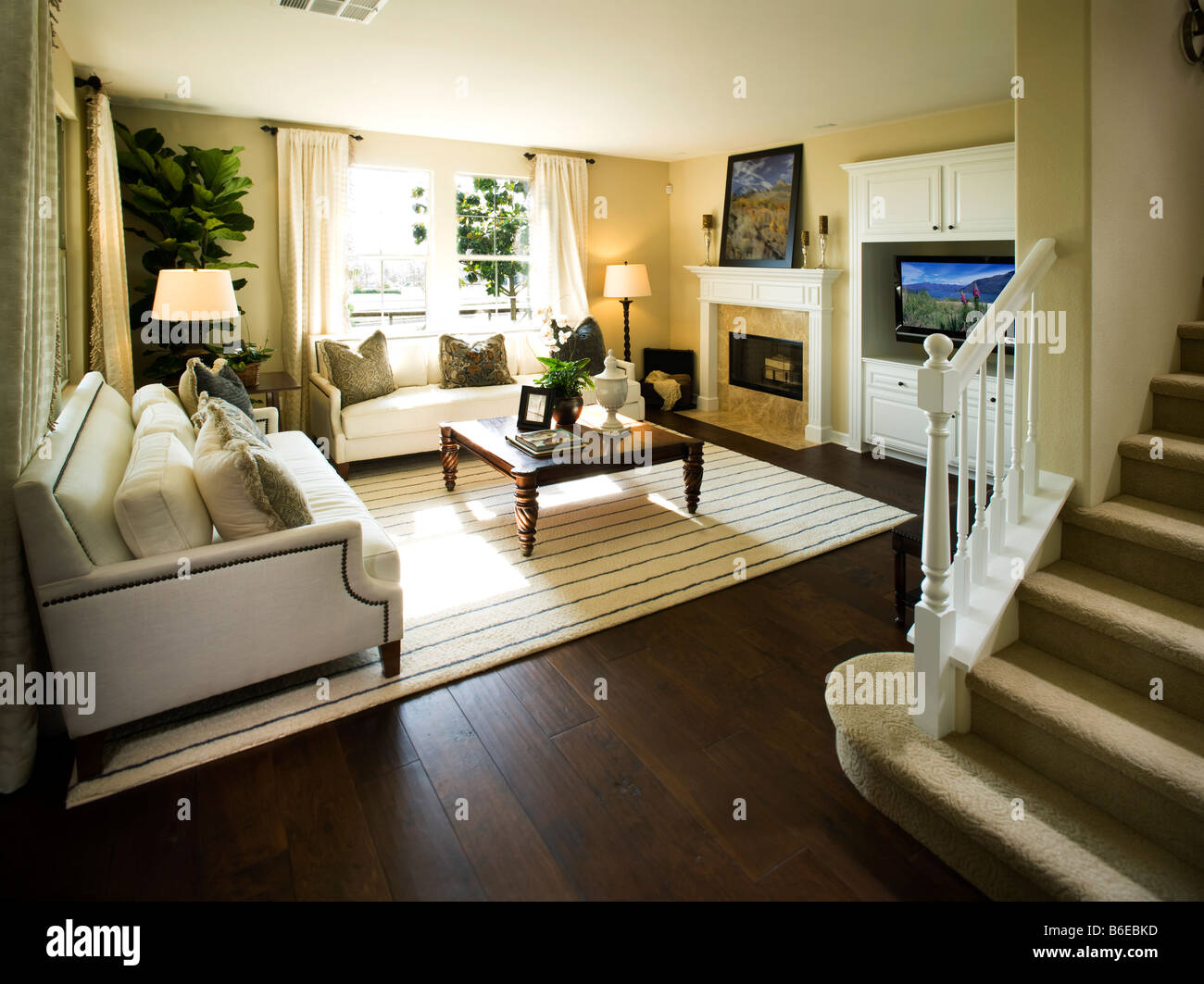 Interior traditional living room with staircase Stock Photo - Alamy
