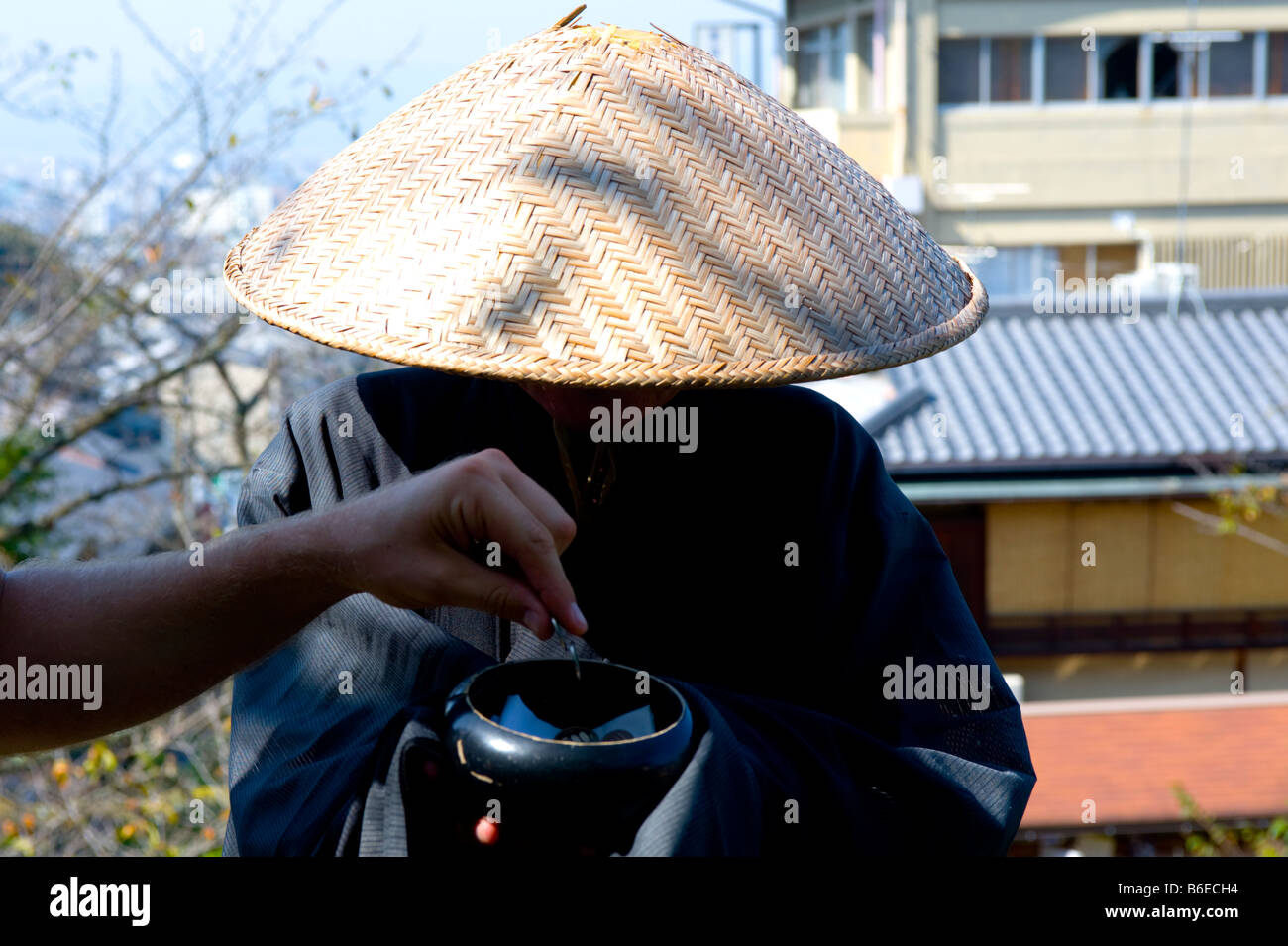 A Japanese Buddhist Monk being given alms at the Kiyomizudera Temple in ...