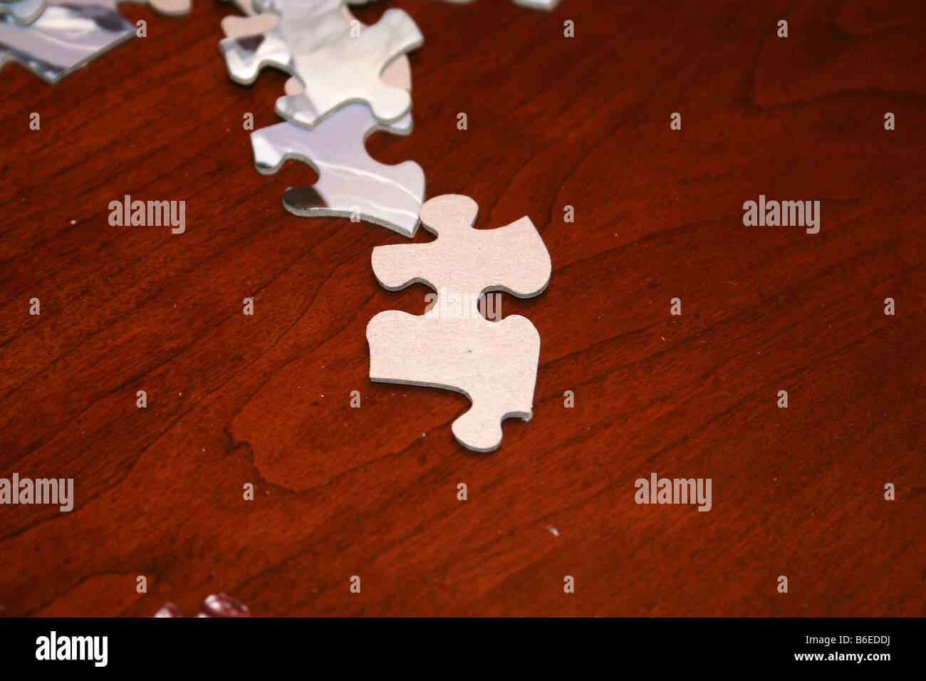 Jigsaw pieces fitting together hi-res stock photography and images - Alamy