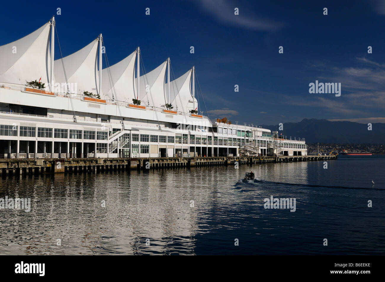 Canada Place pier and sails with blue sky and North Vancouver Coastal ...