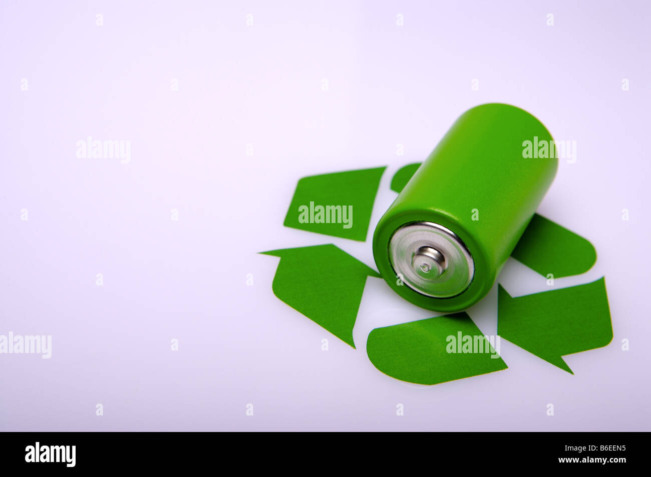 Green battery on top of an imprinted green recycling symbol Stock Photo ...