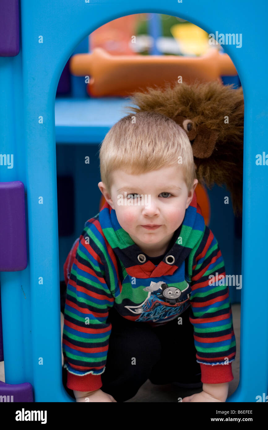 Boy in play gym outside Stock Photo - Alamy