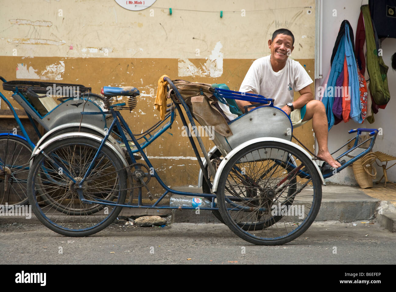 Vietnamese Cyclo driver Stock Photo - Alamy