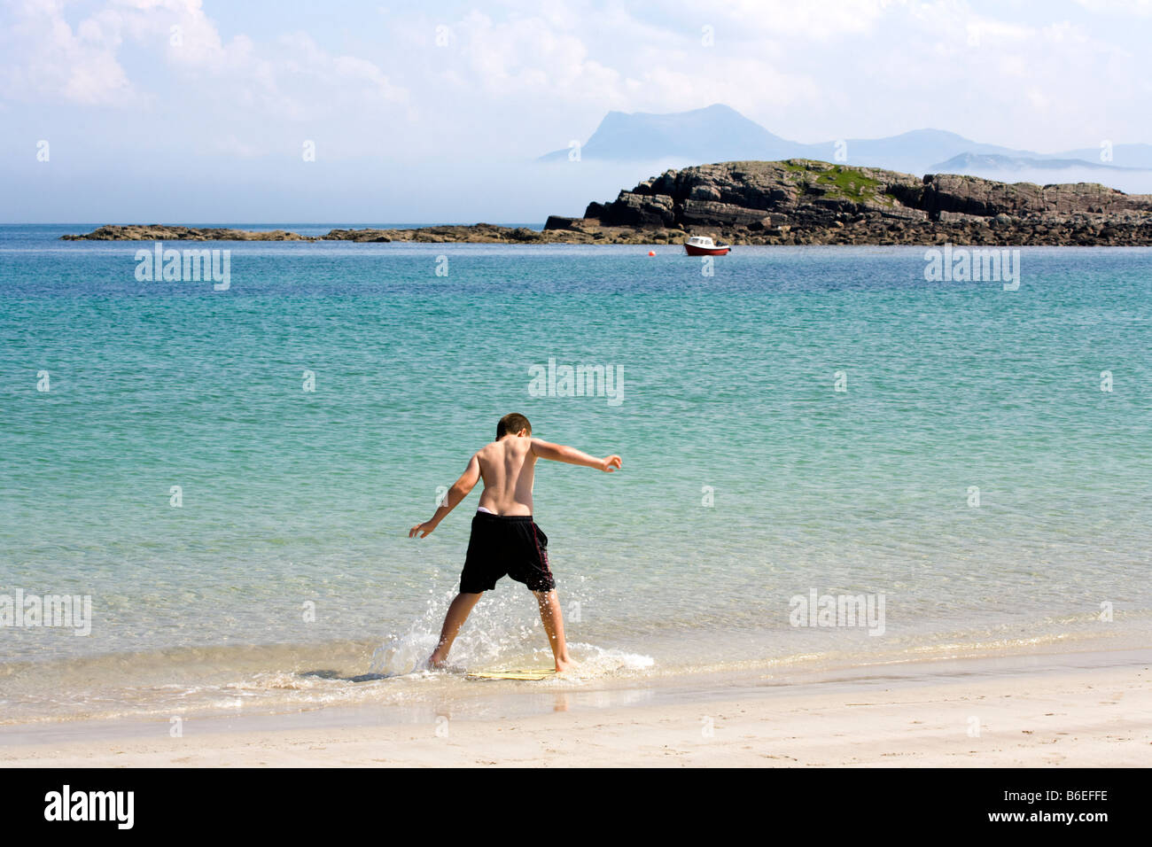 Skim boarding on beach hi-res stock photography and images - Alamy