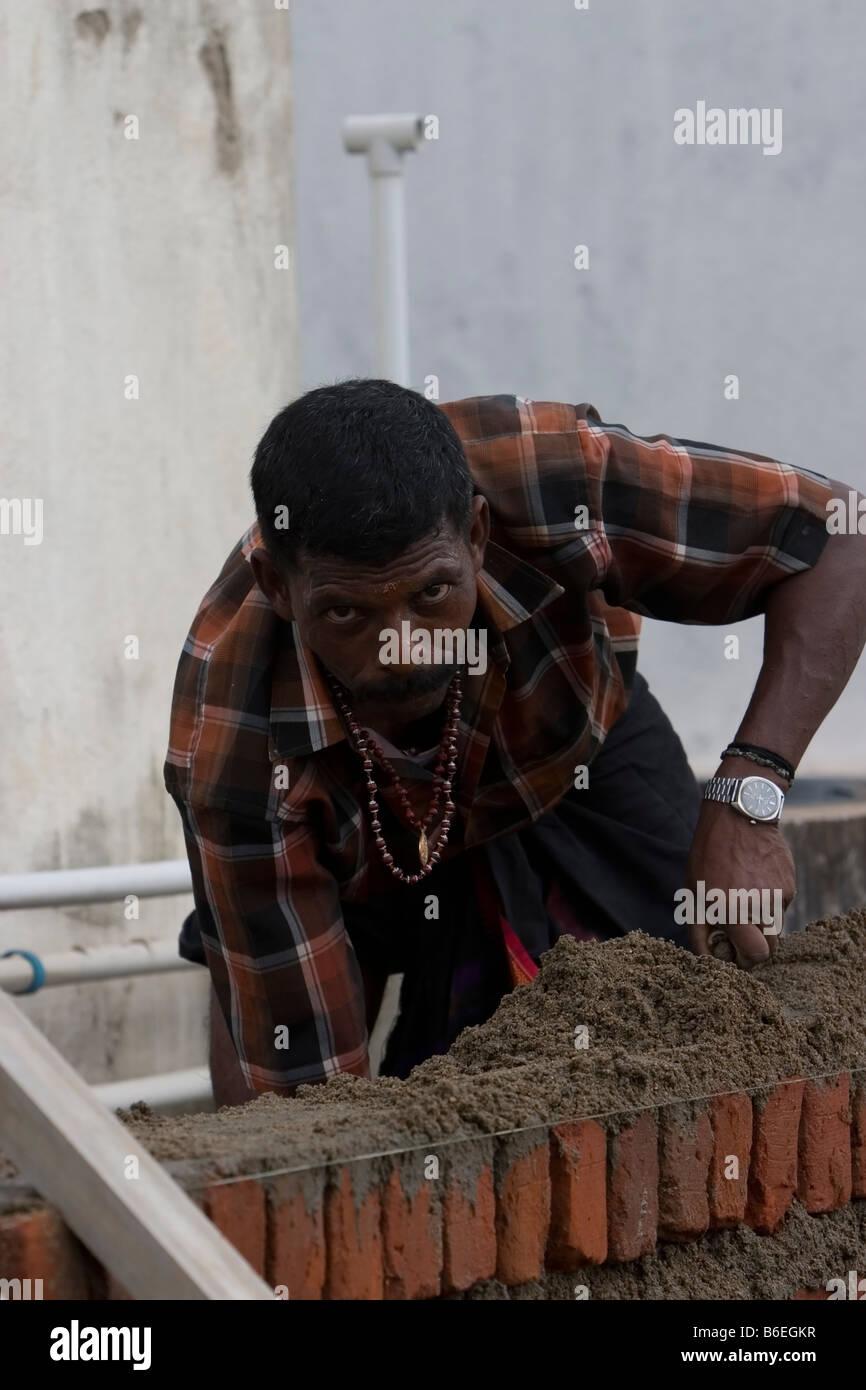 A mason building a brick wall Stock Photo - Alamy
