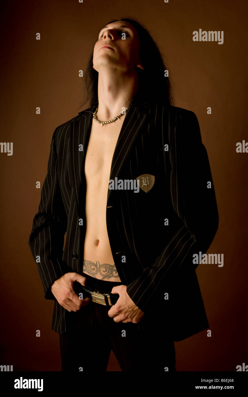 Finnish musician standing and looking earnest, goth Stock Photo - Alamy
