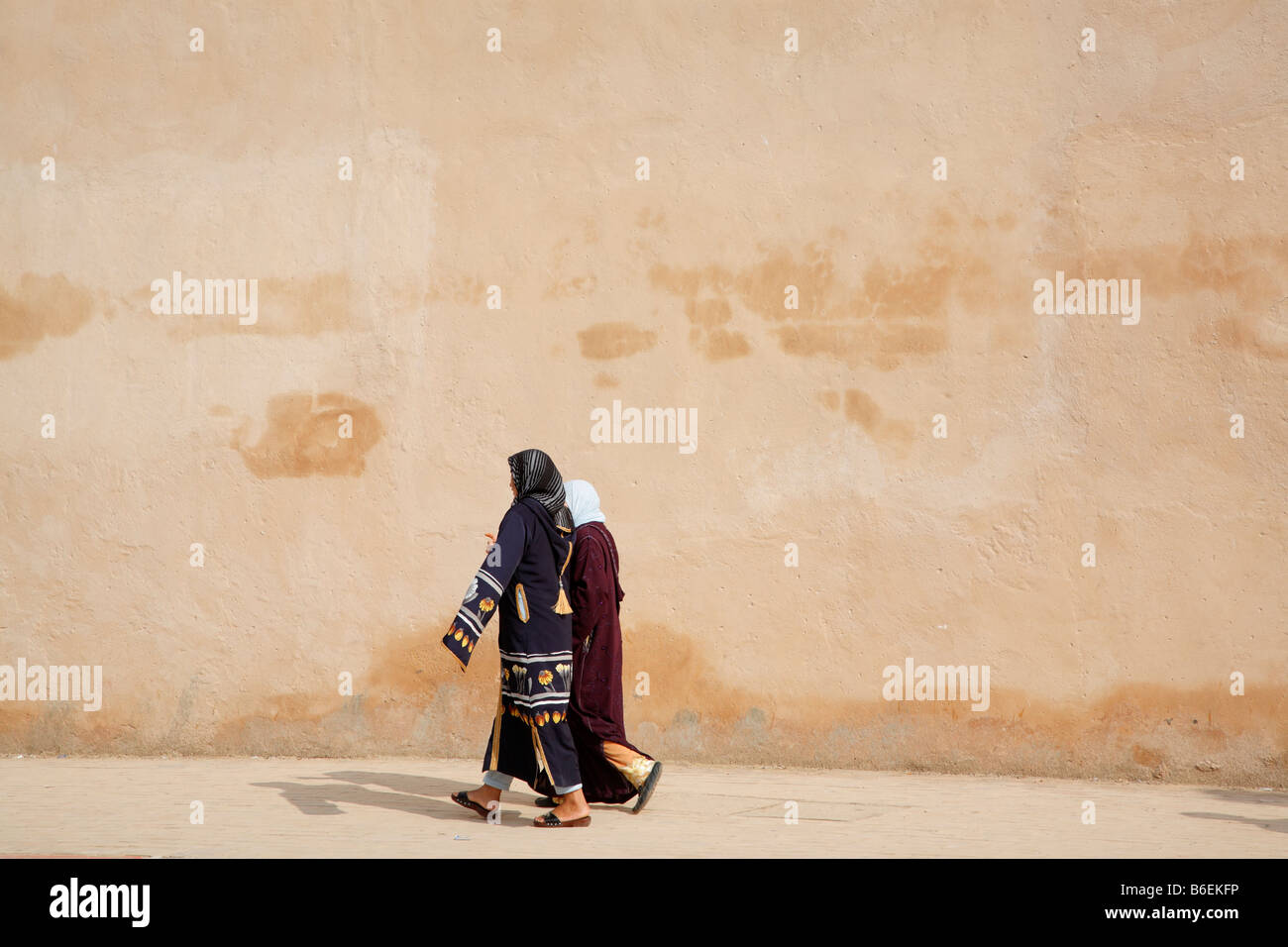 Two women walking near Royal Palace wall, Meknes, Morocco Stock Photo ...