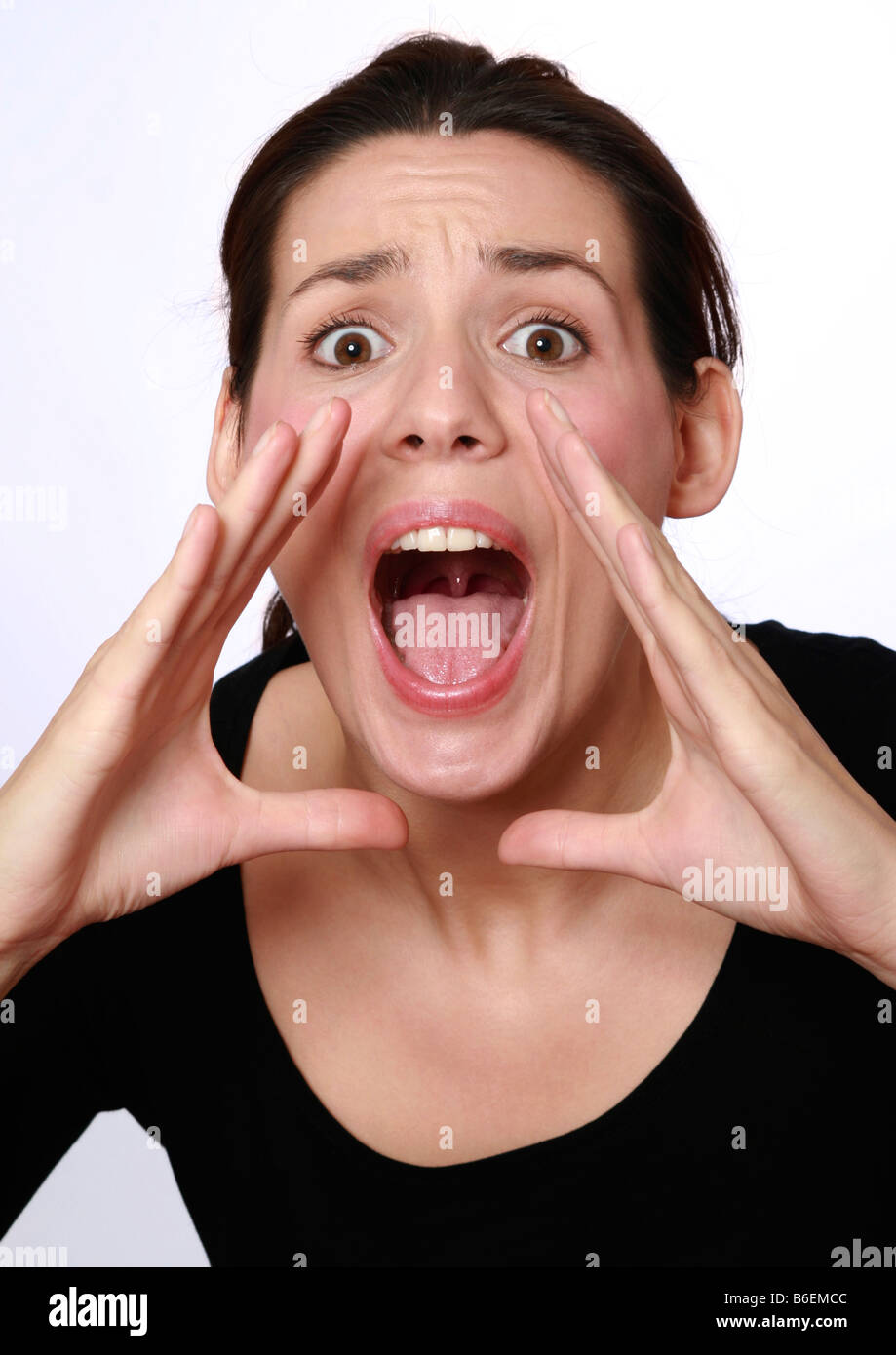 Young woman shouting Stock Photo - Alamy