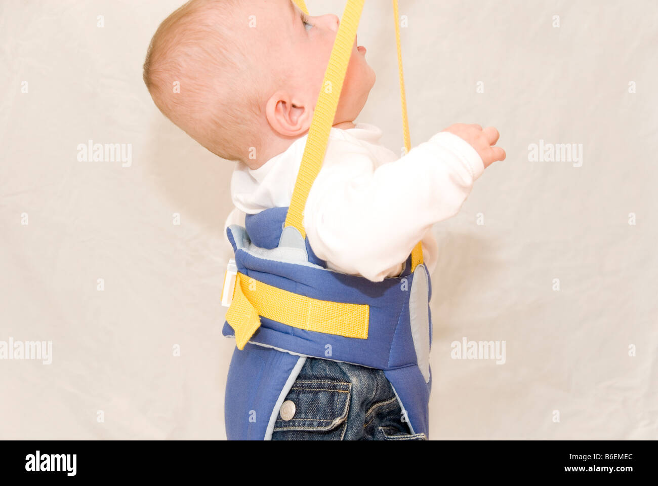 Baby Boy Joshua Kailas Hudson Playing in Baby Bouncer Cut Out on White ...