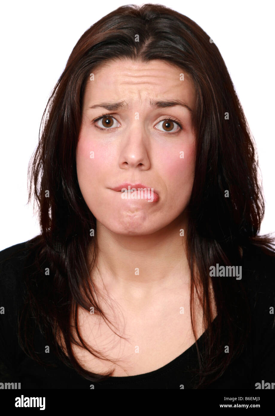 Young woman looking confused Stock Photo - Alamy