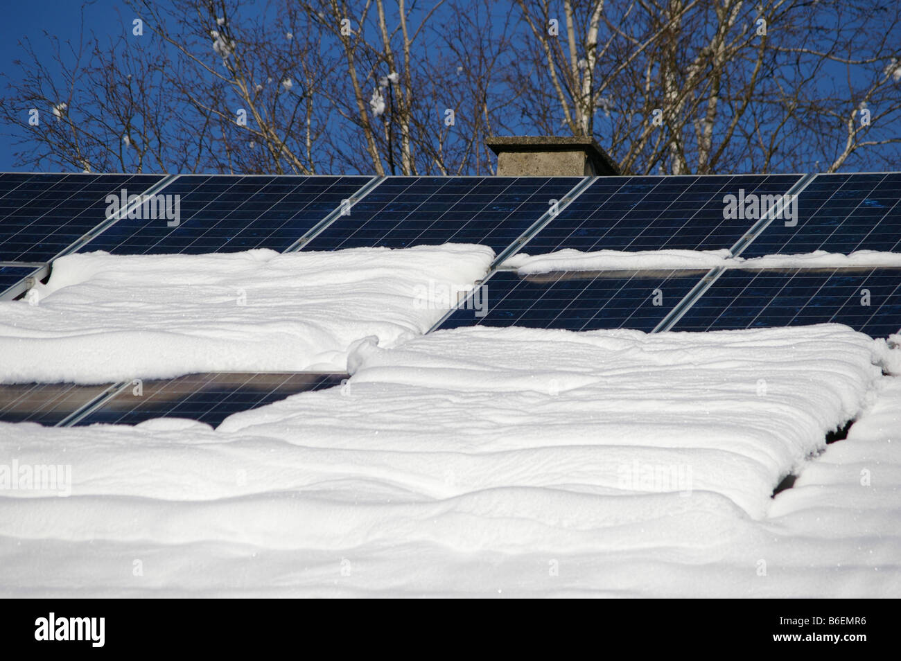 solar cells on a snowy roof Stock Photo - Alamy