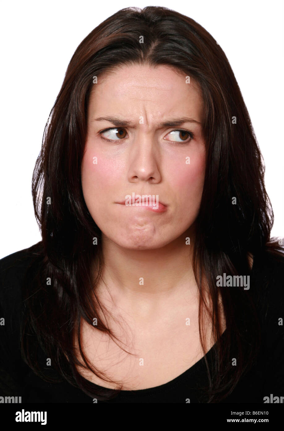 Young woman looking confused Stock Photo - Alamy