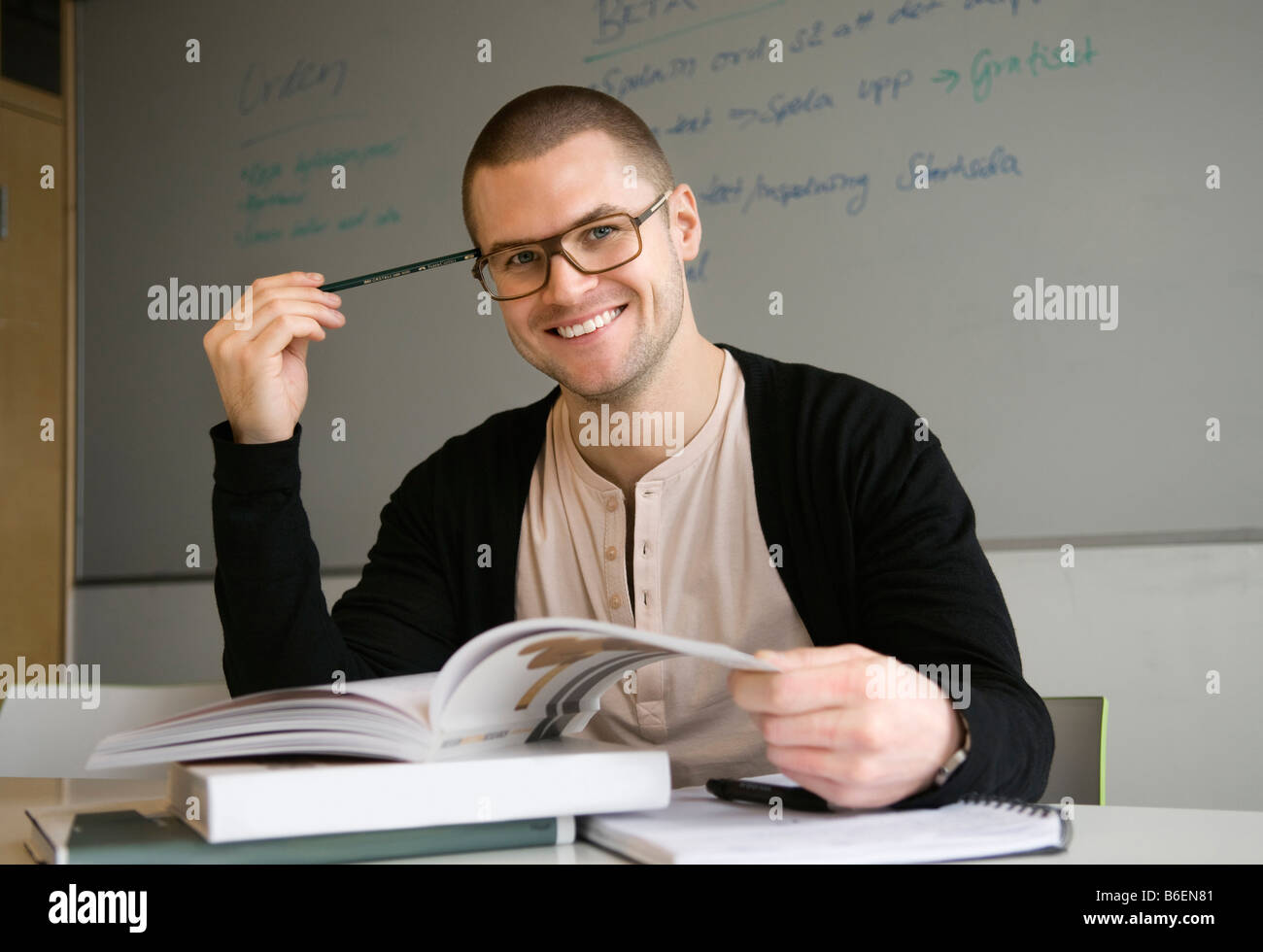Happy guy studying Stock Photo - Alamy