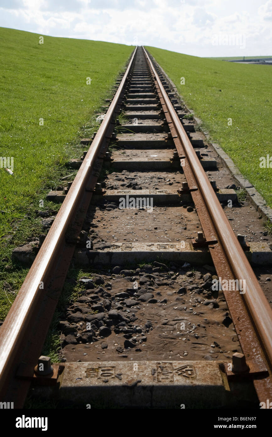 Freight wagon track on the North Sea embankment near Luettmoorsiel ...