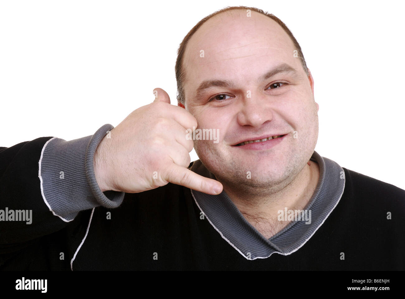 man making hand signal, phoning Stock Photo - Alamy