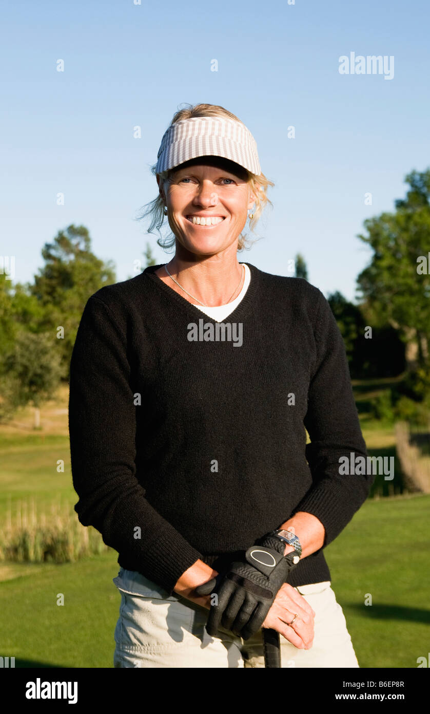 Woman on golf course Stock Photo - Alamy