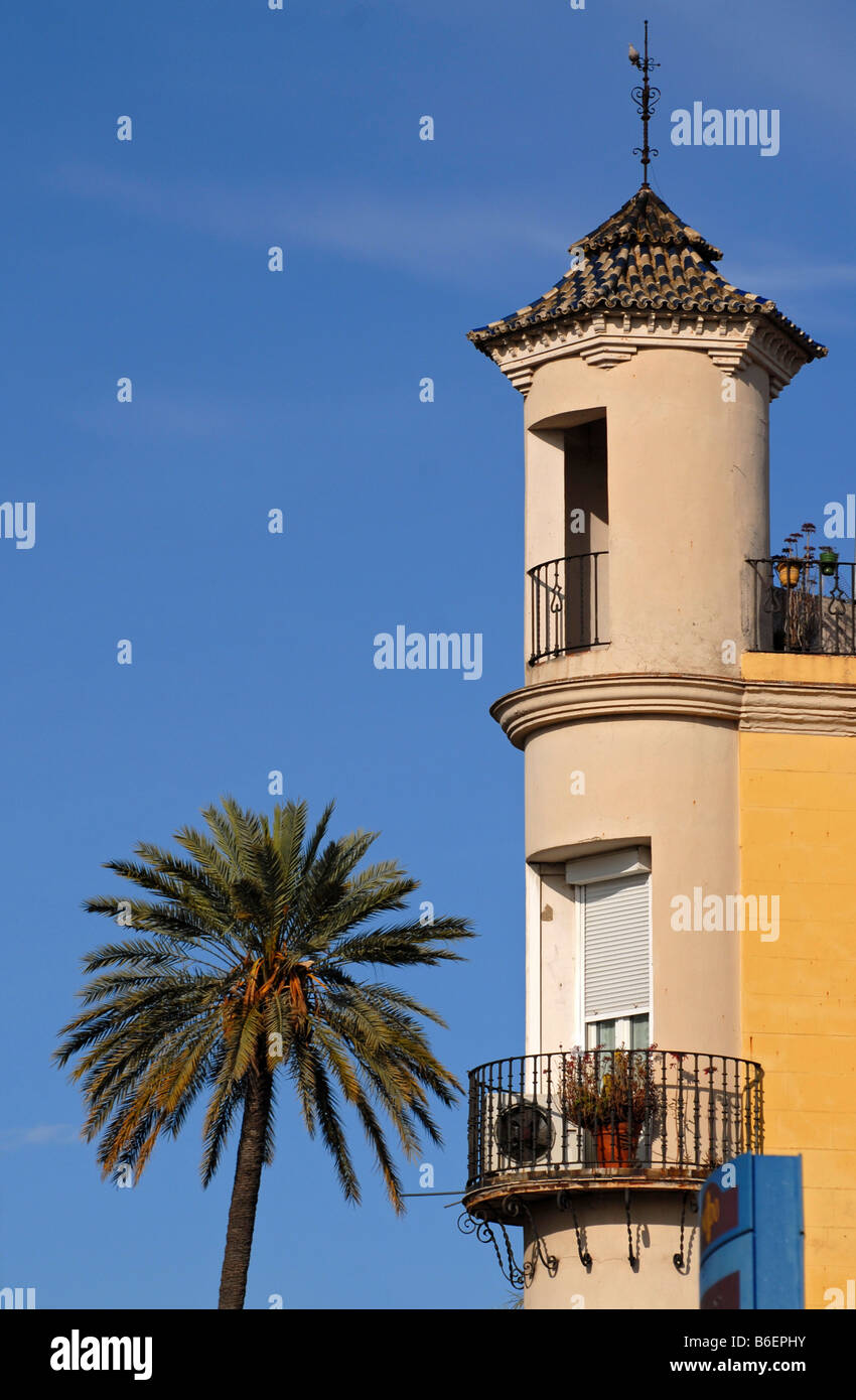 A small tower and palm tree in Sevilla, Andalusia, Spain, Europe Stock ...