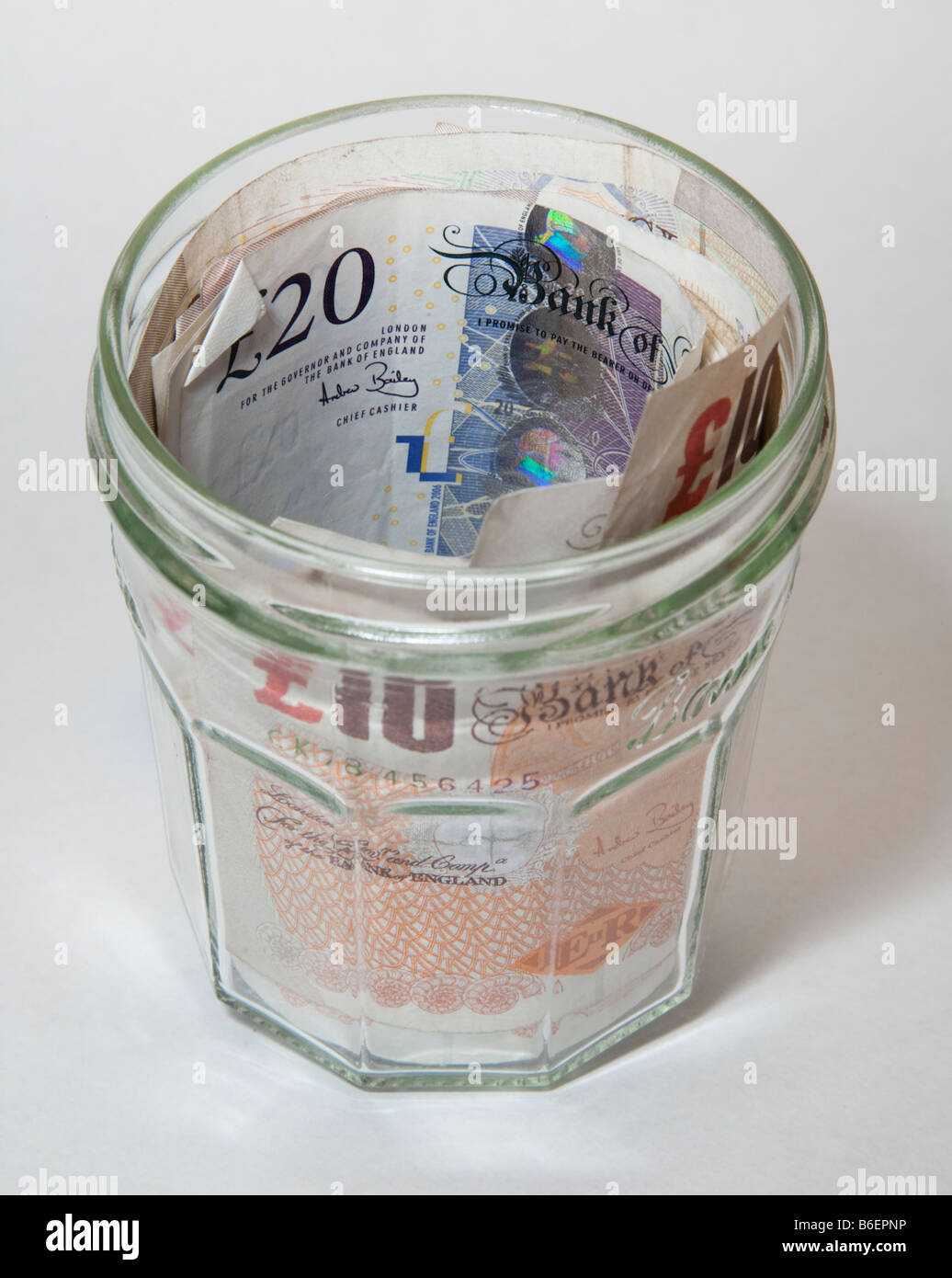 £10 and £20 notes being saved in a glass jar as an alternative to ...