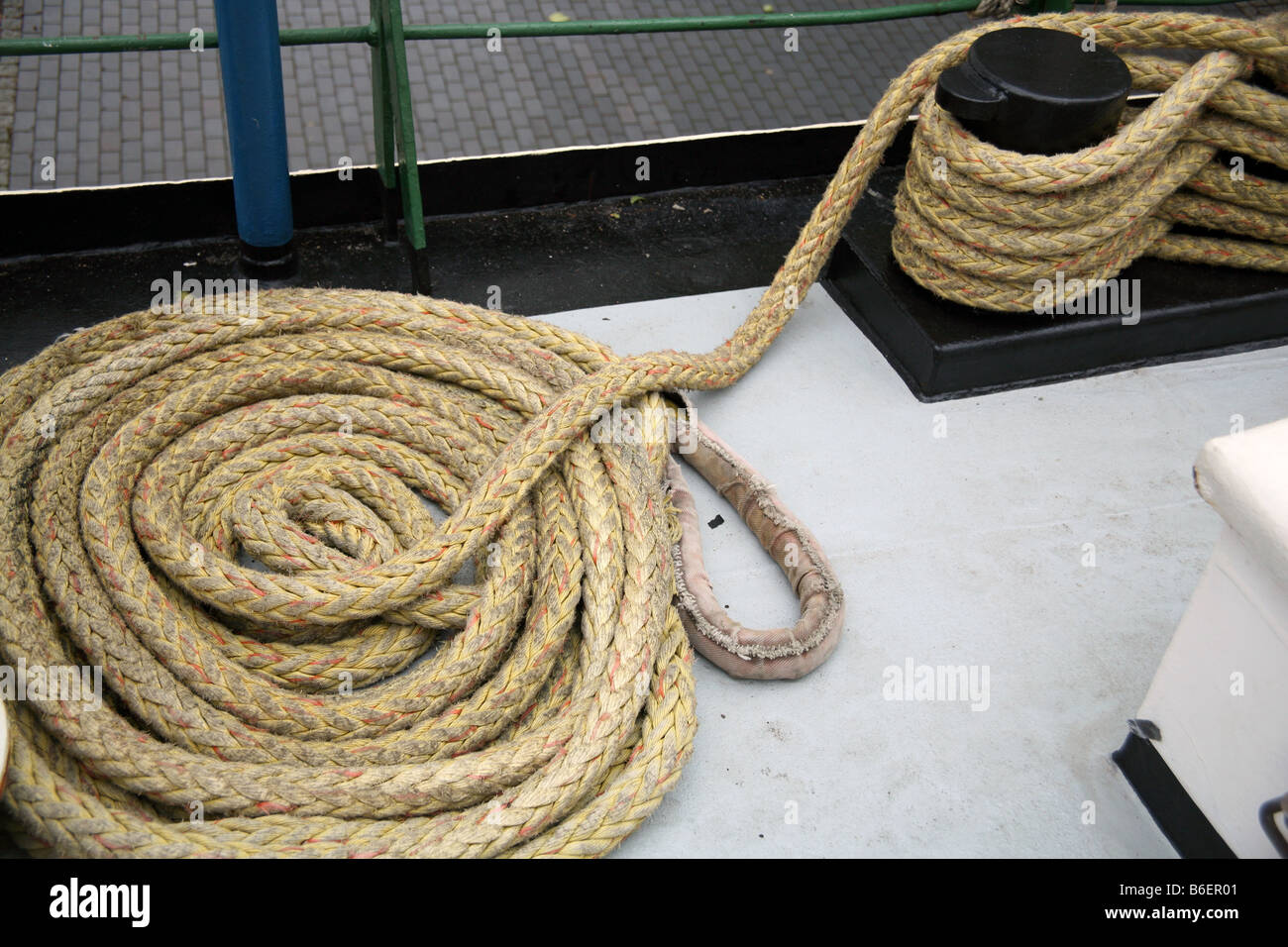 Coiled ropes on moored ship Stock Photo - Alamy