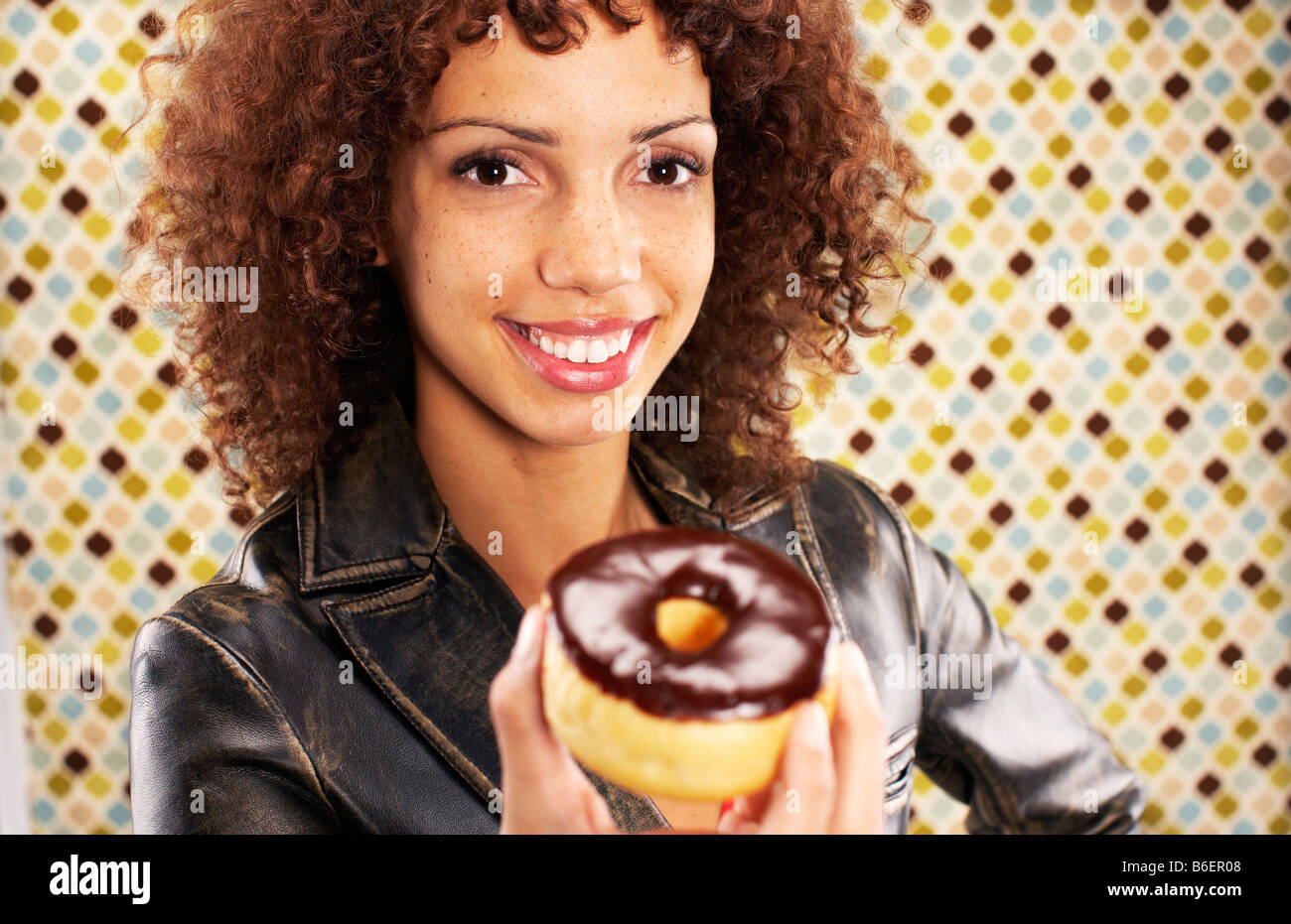 Portrait of an African American woman, wearing a leather jacket and ...
