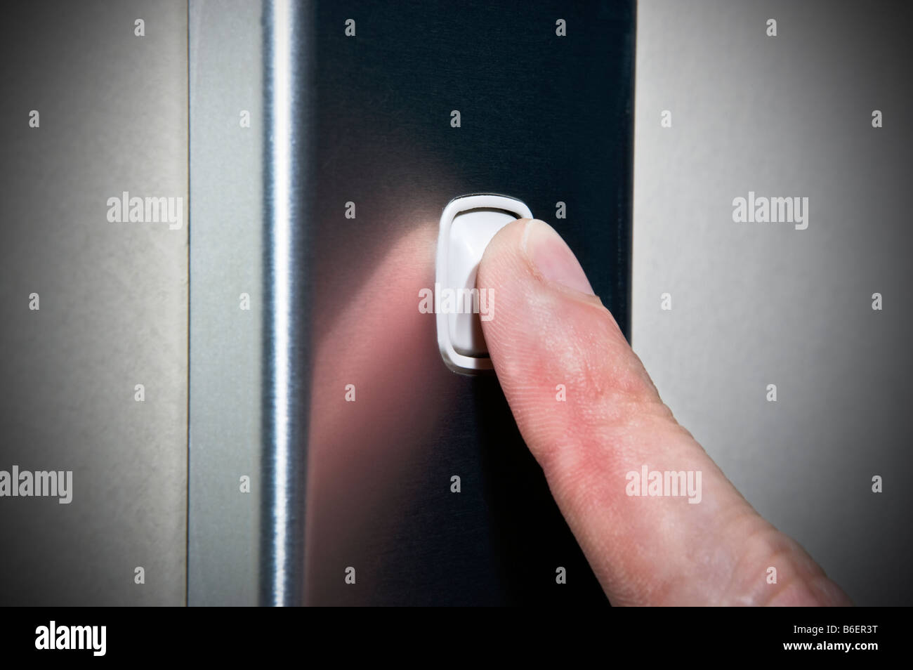 A finger flicking a light switch Stock Photo - Alamy