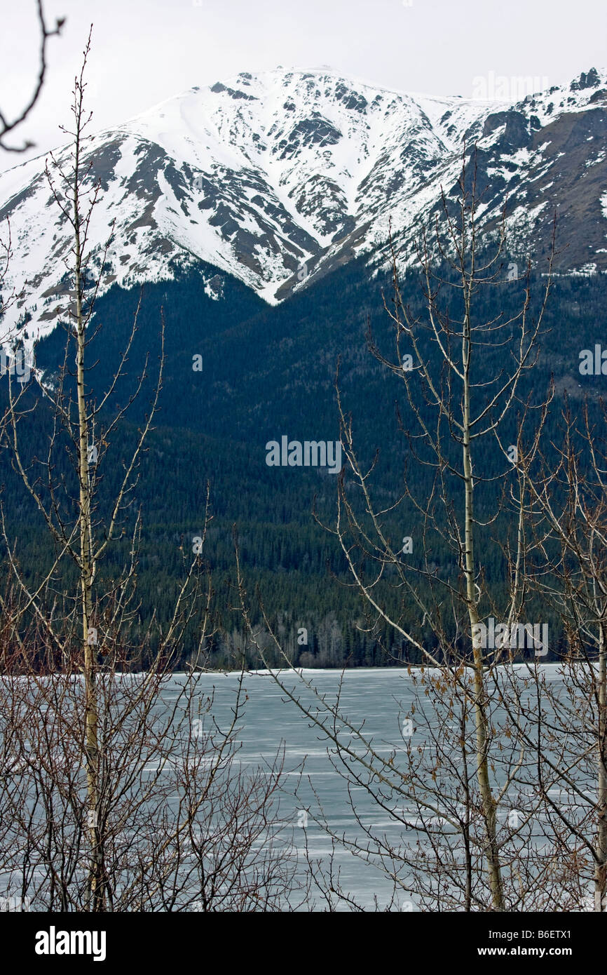 Mountain top towers over a frozen lake in BC Canada Stock Photo - Alamy