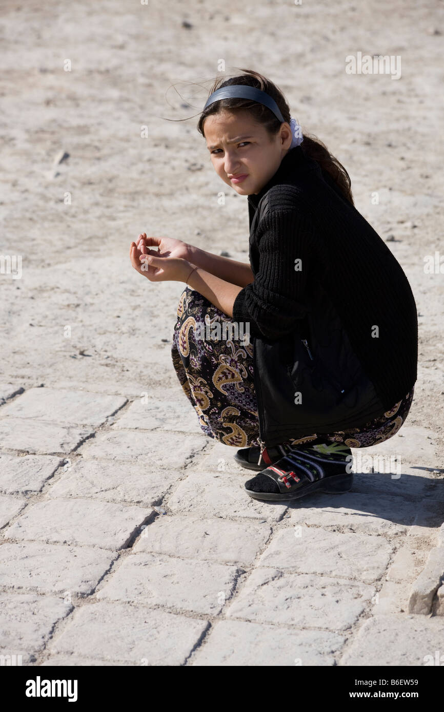 Turkman girl praying at the shrine of Jamal al-Din, Anau, Turkmenistan ...