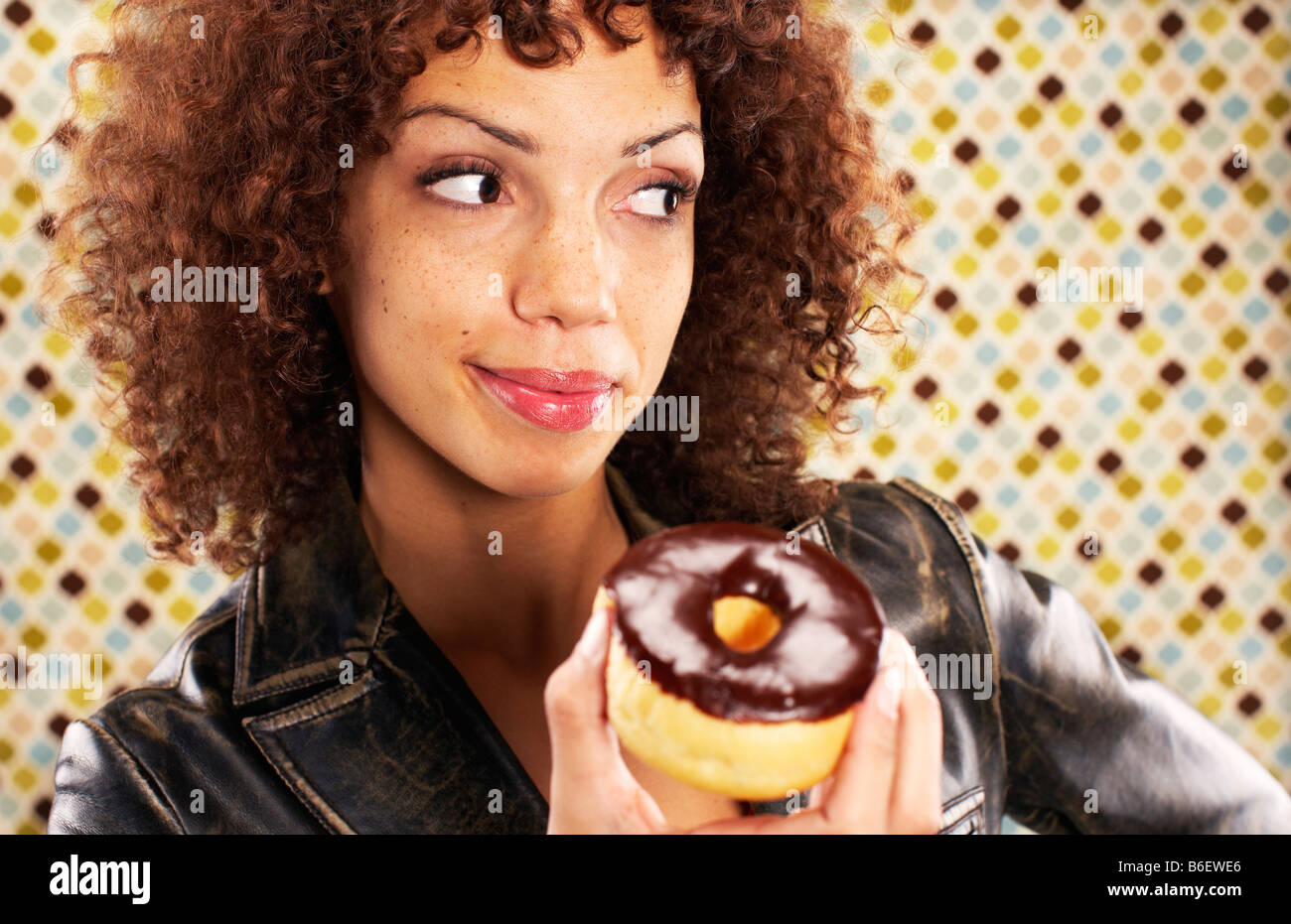 Portrait of an African American woman, wearing a leather jacket and ...