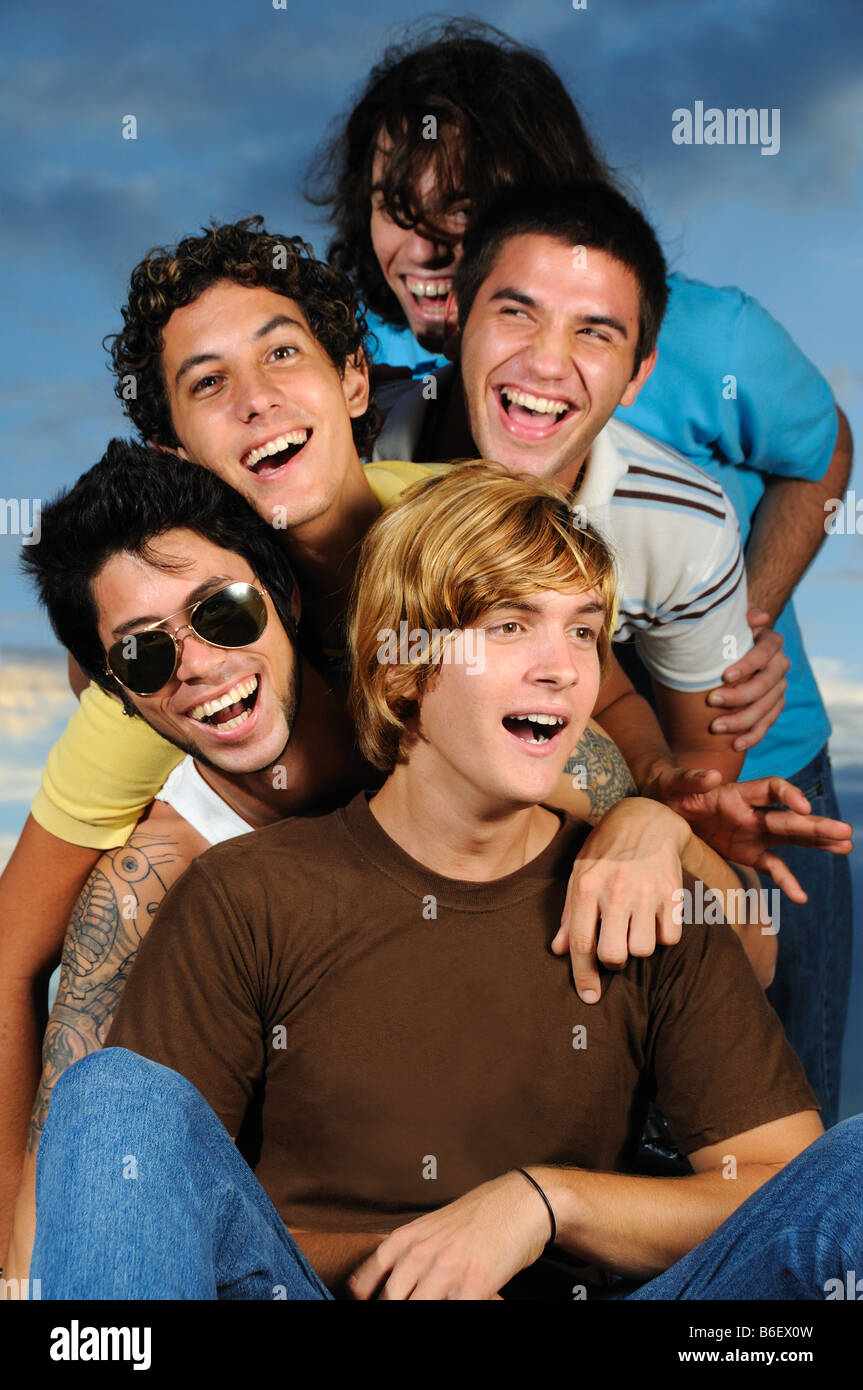 Portrait of young male friends having fun together Stock Photo - Alamy