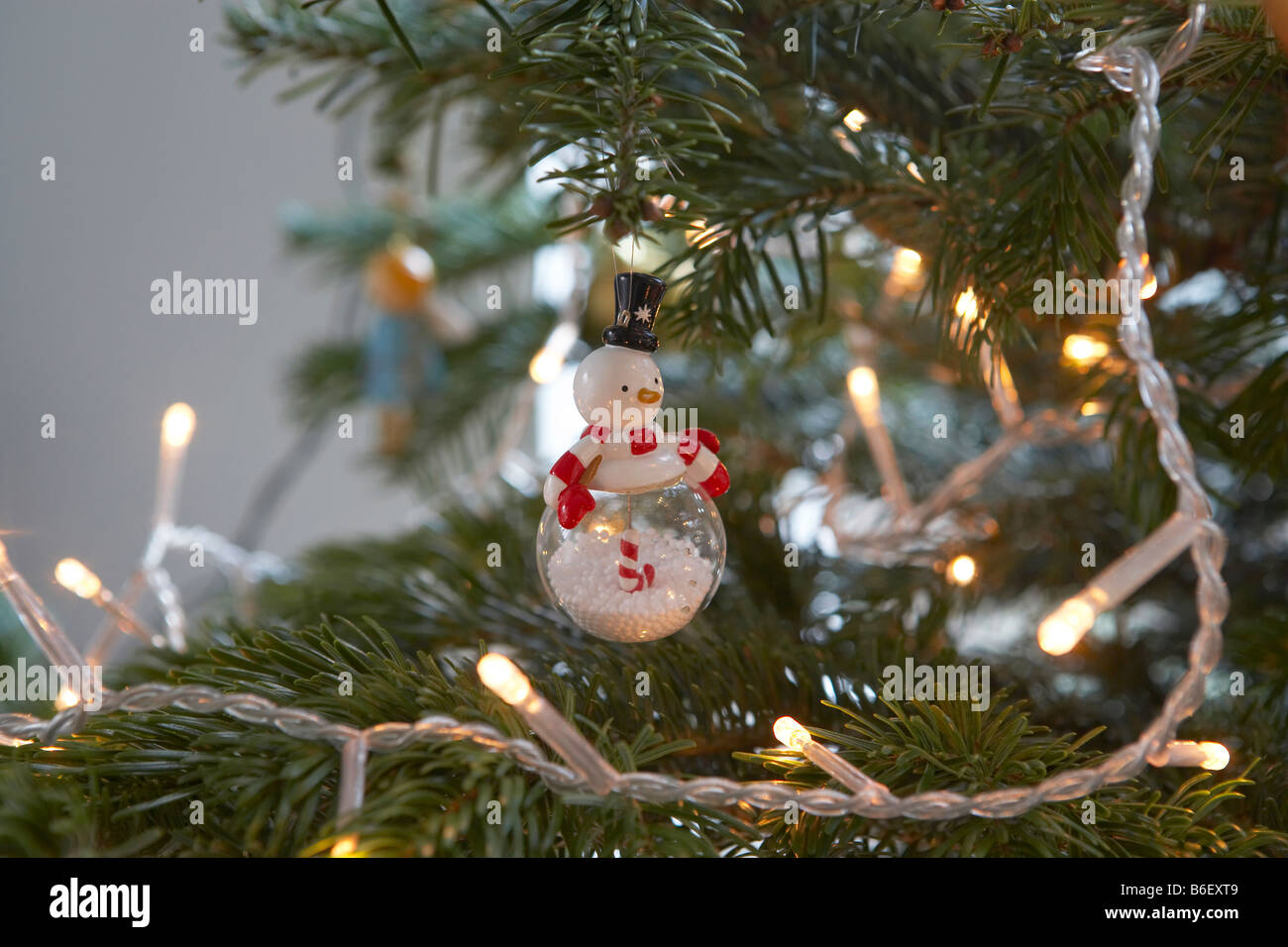 Snowman on a christmas tree Stock Photo - Alamy