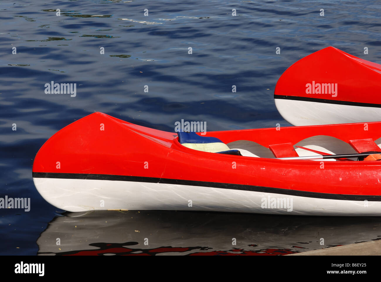 two rowing boats on water, red and white Stock Photo - Alamy