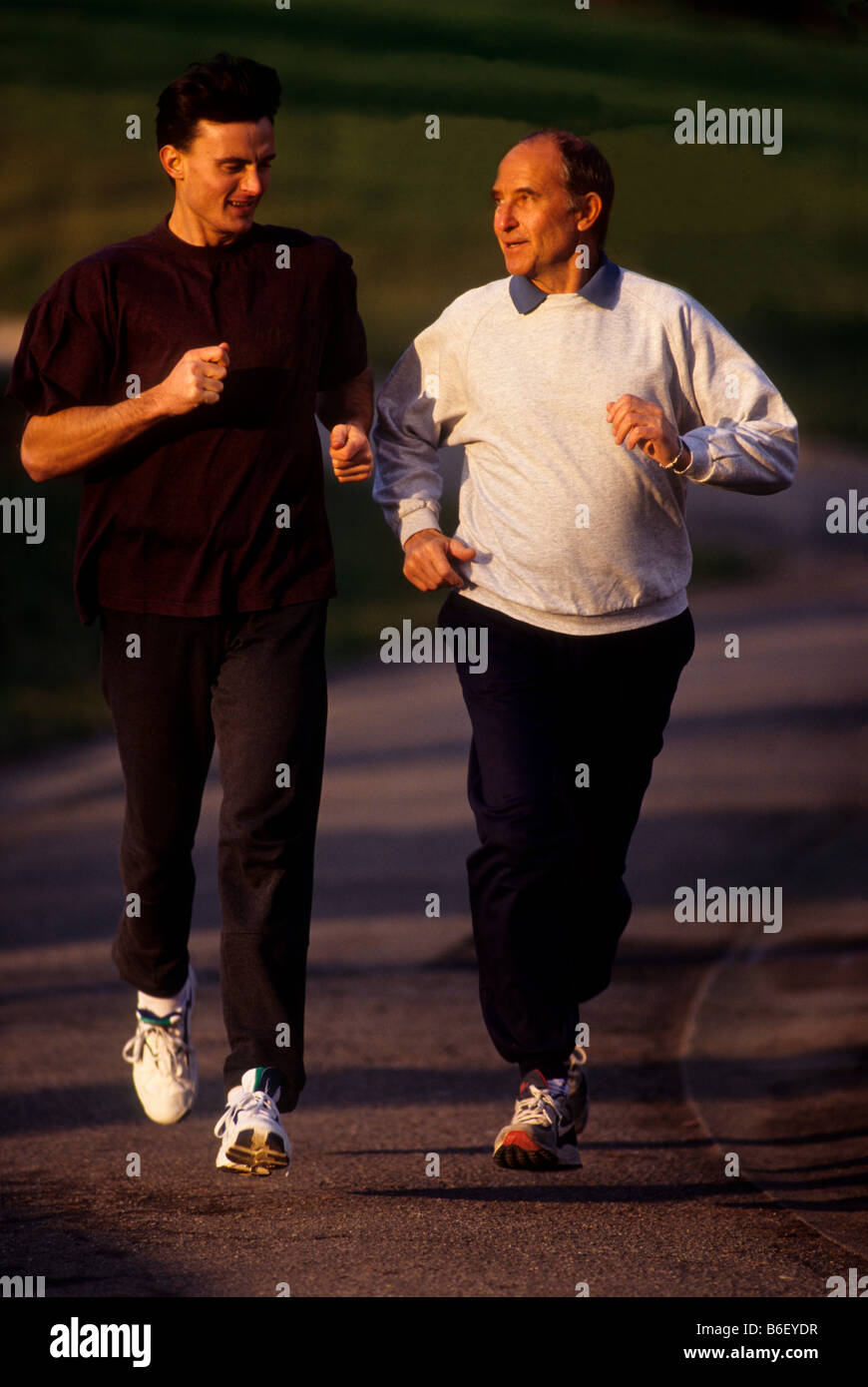 Father and son running together for exercise Stock Photo - Alamy