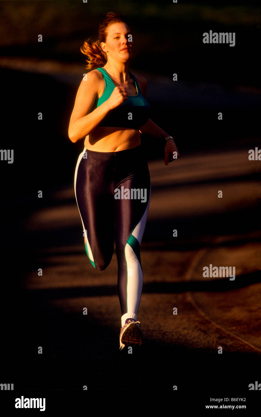 Young woman running for exercise Stock Photo - Alamy