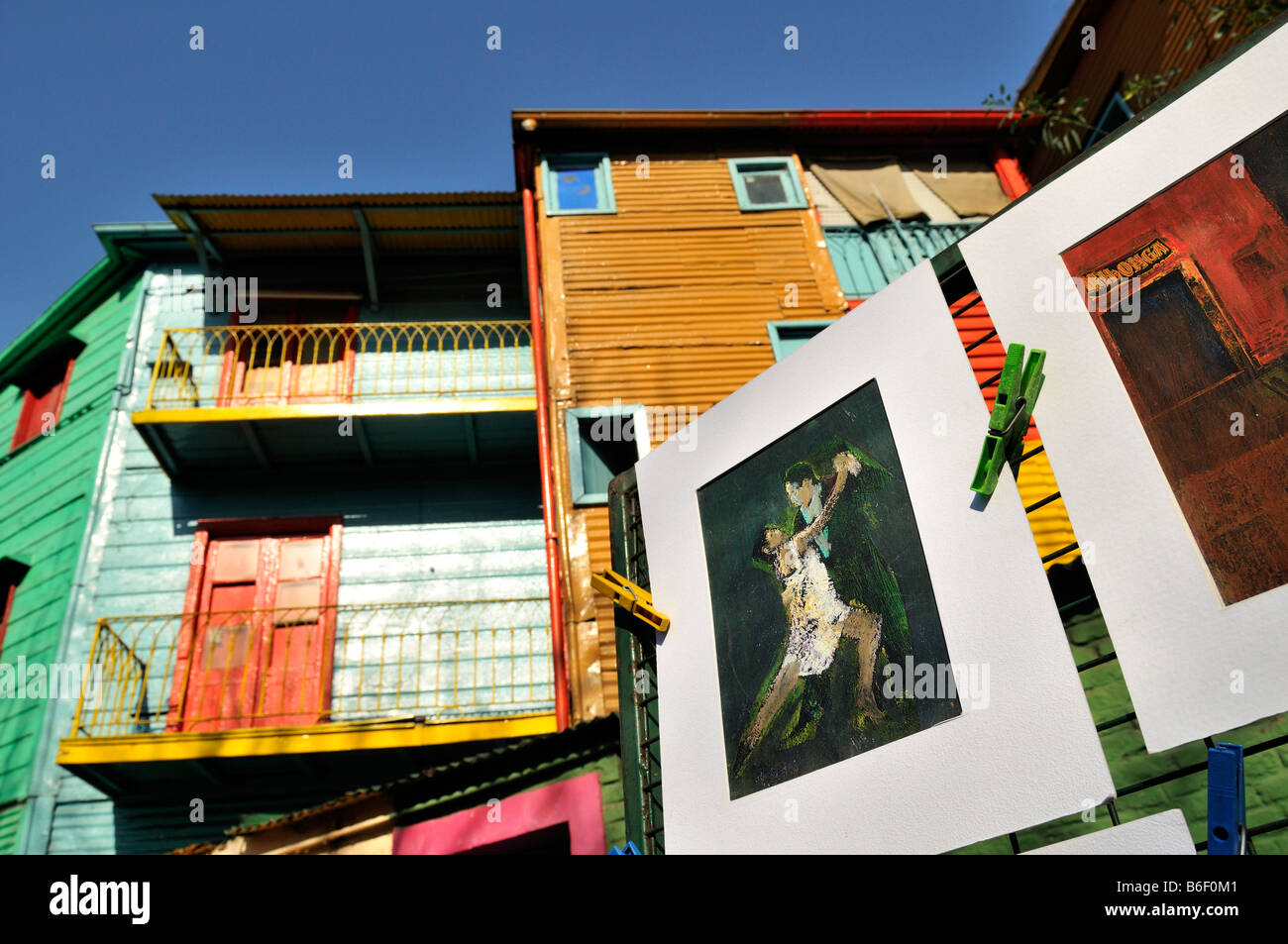 Painting with tango dancers and colourfully painted houses in the dock ...