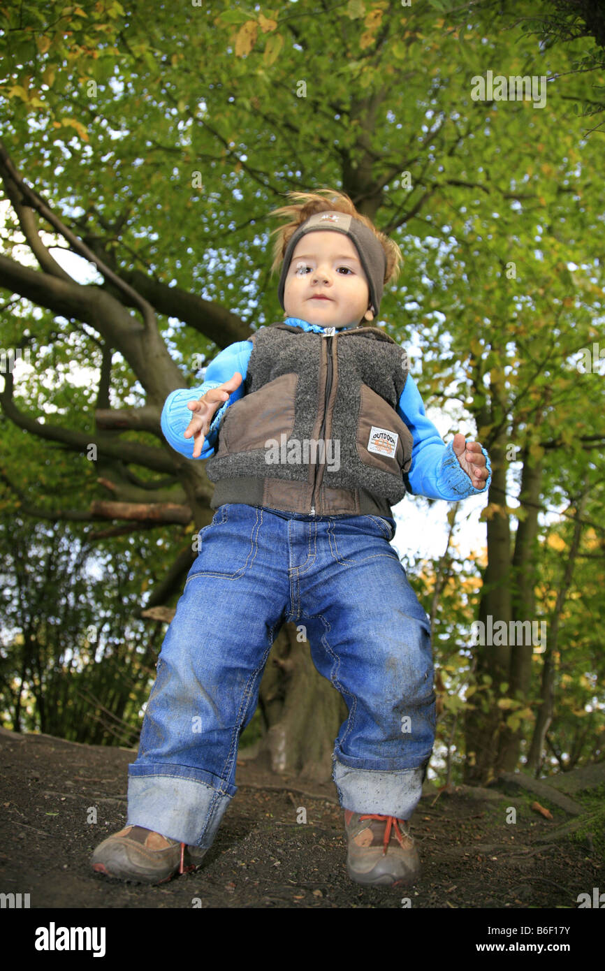 little boy standing in the forest Stock Photo - Alamy