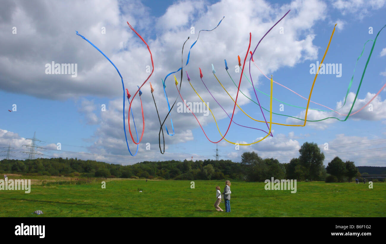 kites, eleven kites on top of each other, children running for cover ...