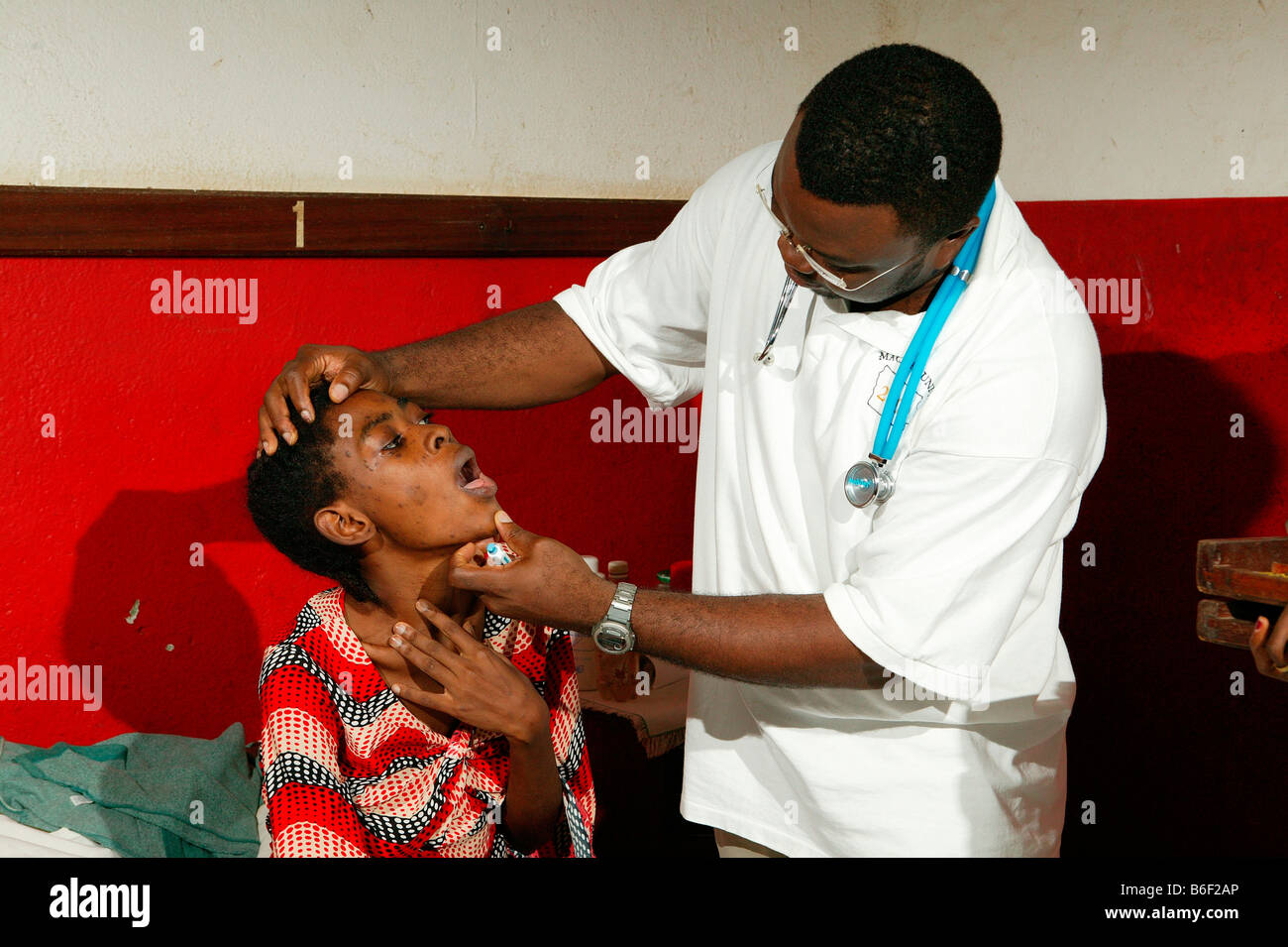 Examination and treatment of an AIDS/HIV patient in a hospital in ...