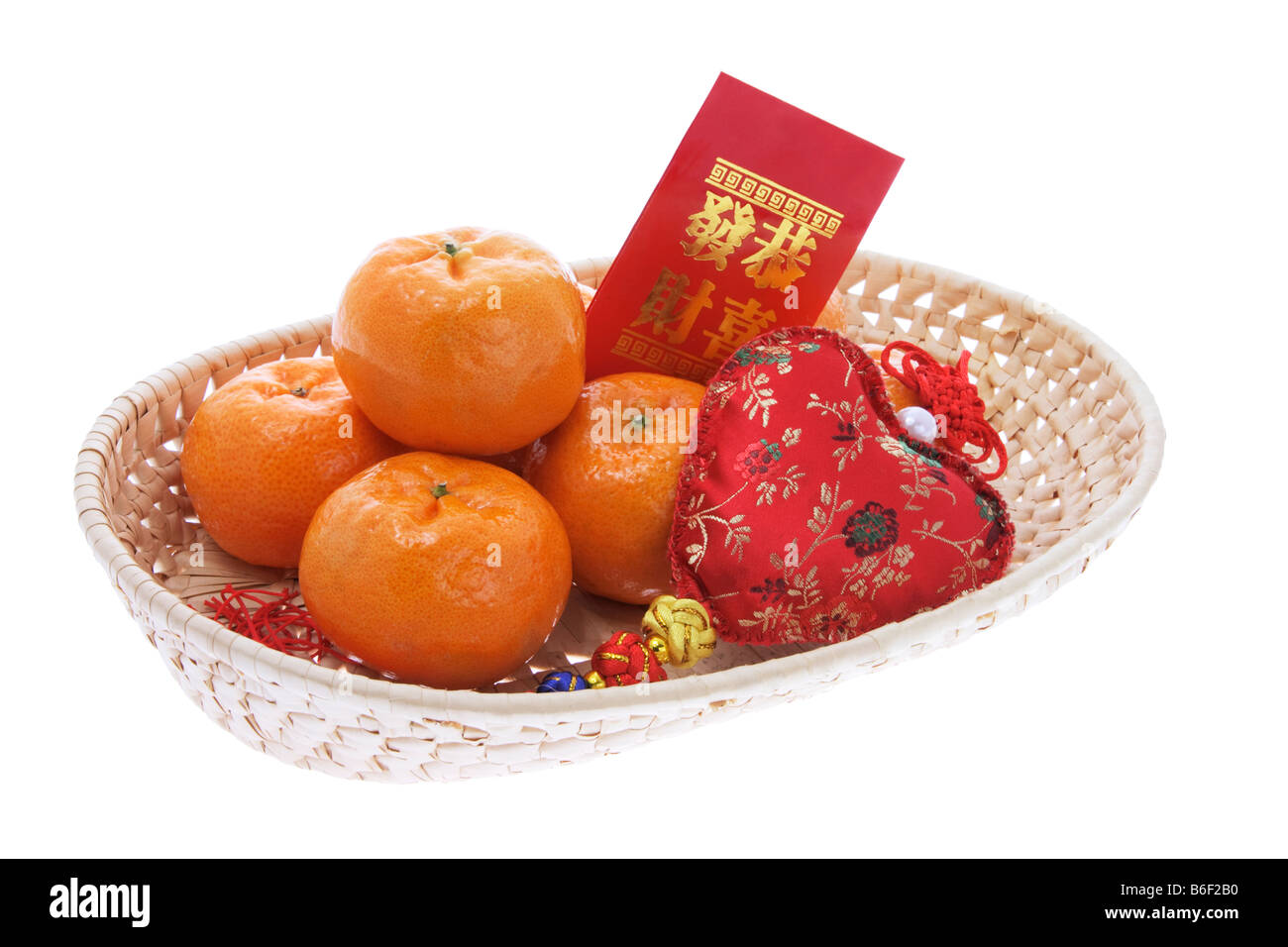 Mandarins and Red Packets on Basket Stock Photo - Alamy