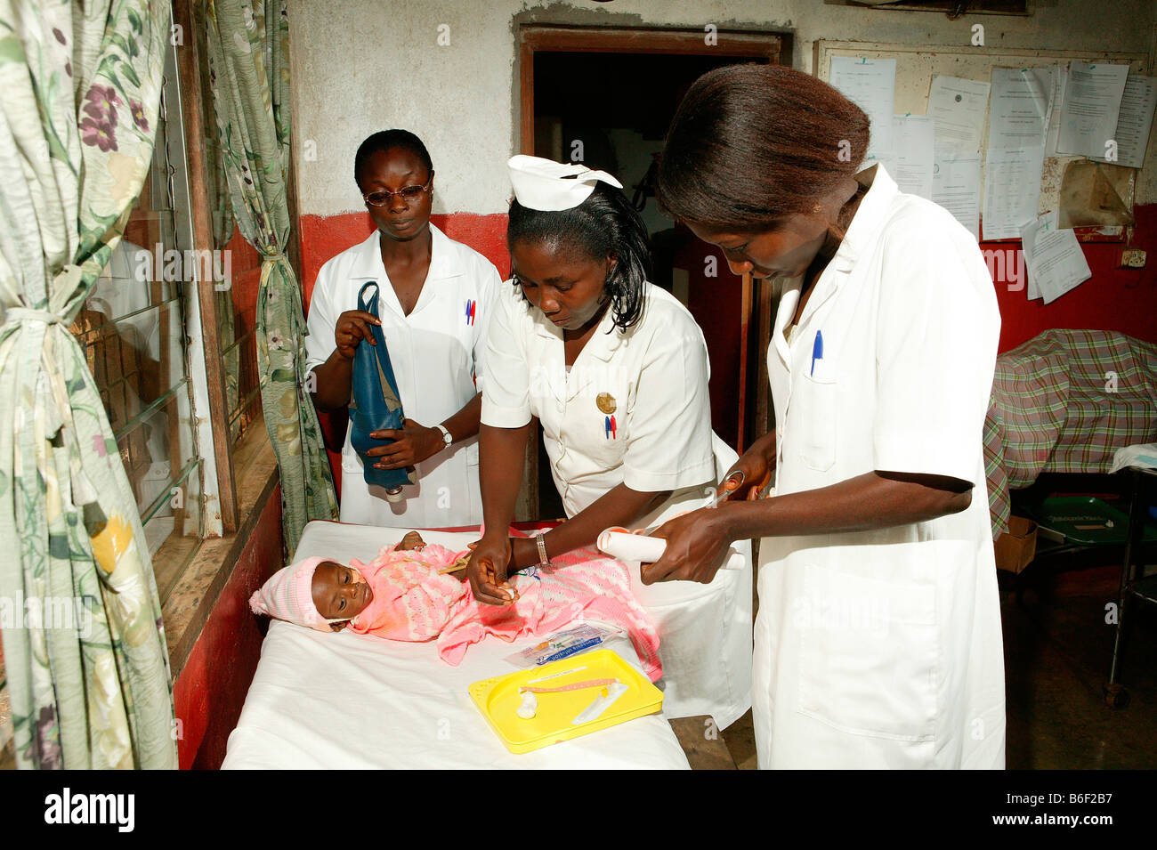 Examination and treatment of an AIDS/HIV infant in a hospital in ...