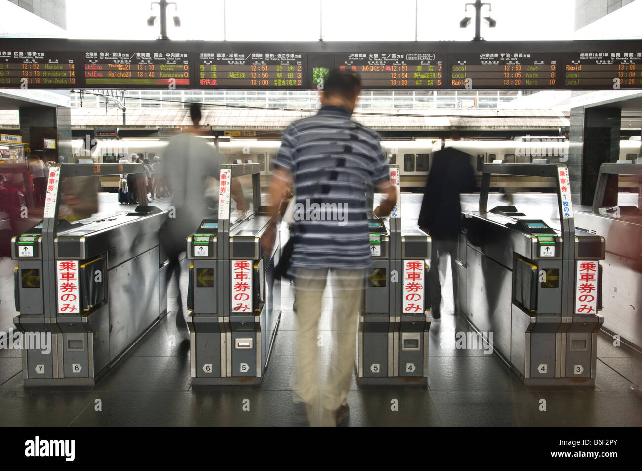 Commuter Entering the Train Platform Stock Photo - Alamy