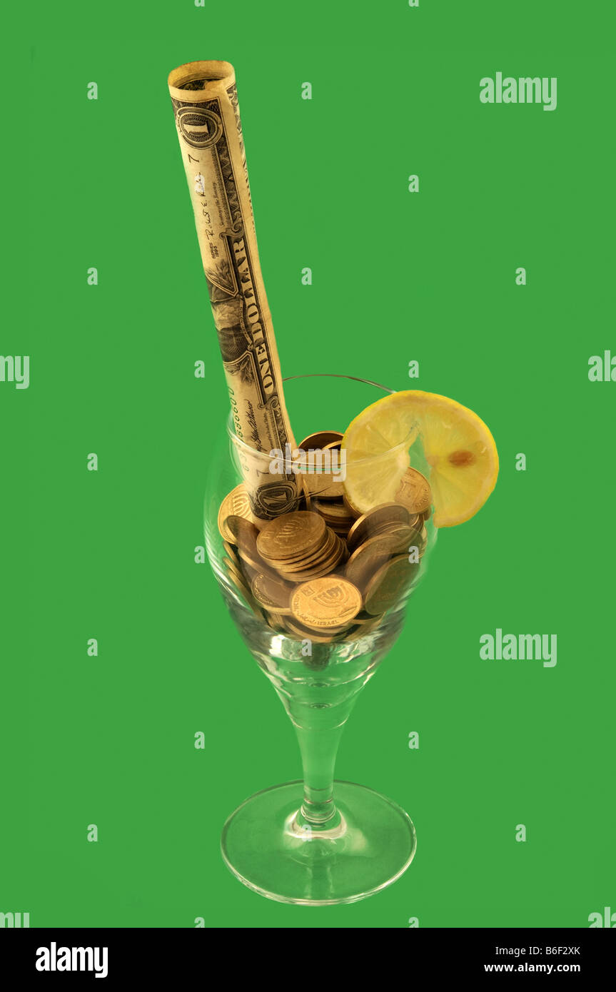 A cocktail of old coins and dollar Stock Photo - Alamy