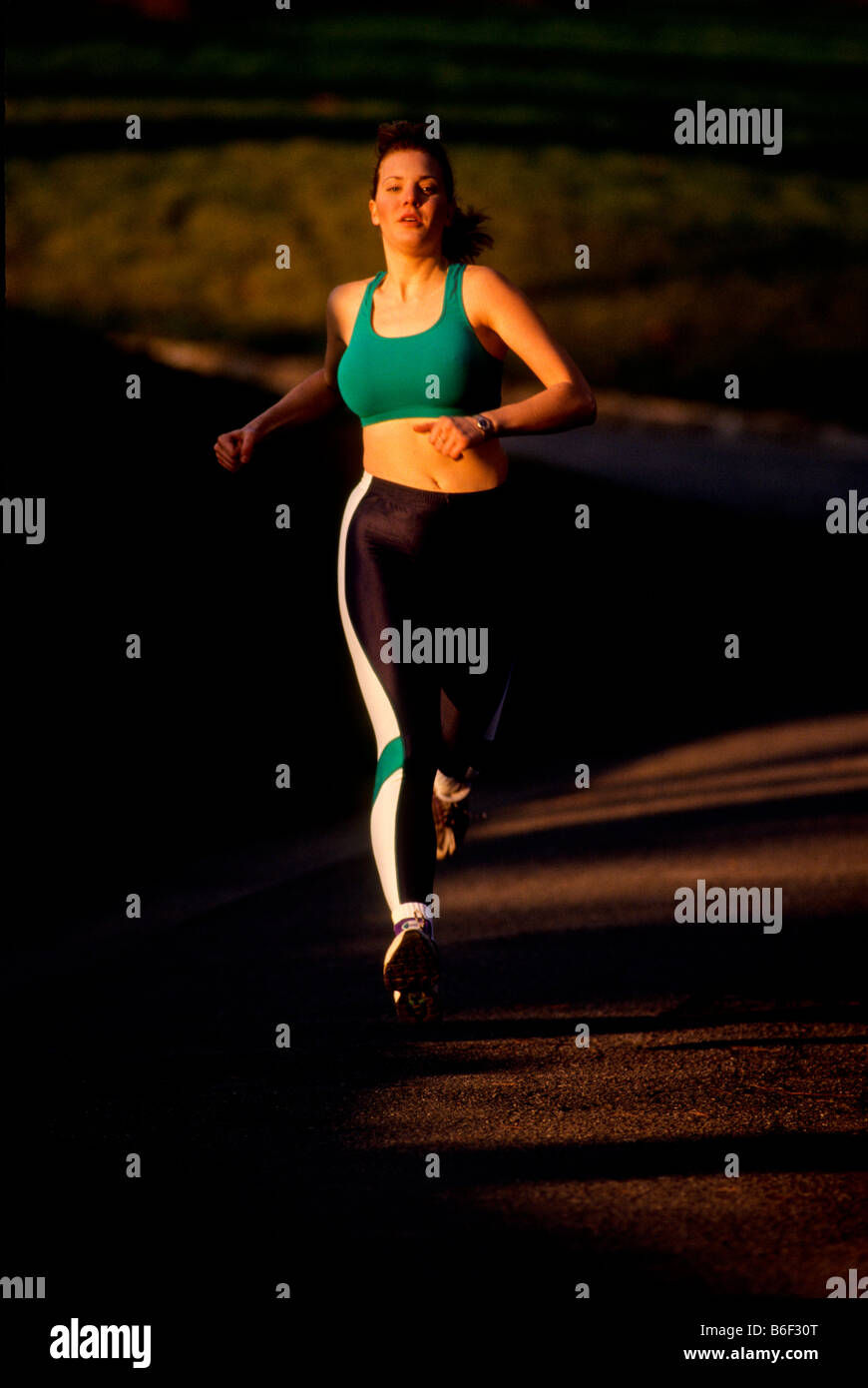Young woman running for exercise Stock Photo - Alamy