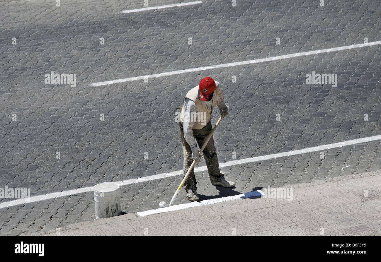 street worker painting street markings Stock Photo - Alamy