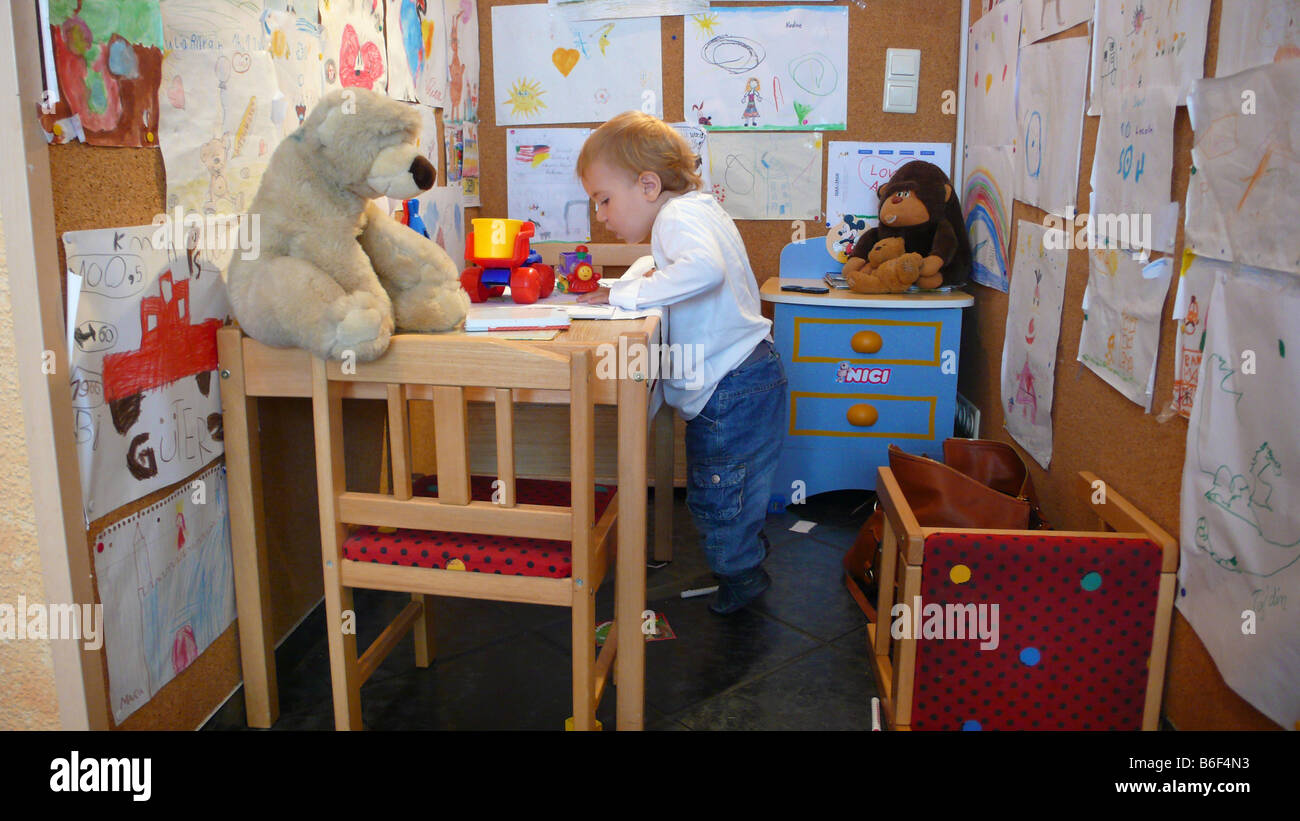 little boy in a waiting corner in a barbarshop Stock Photo - Alamy