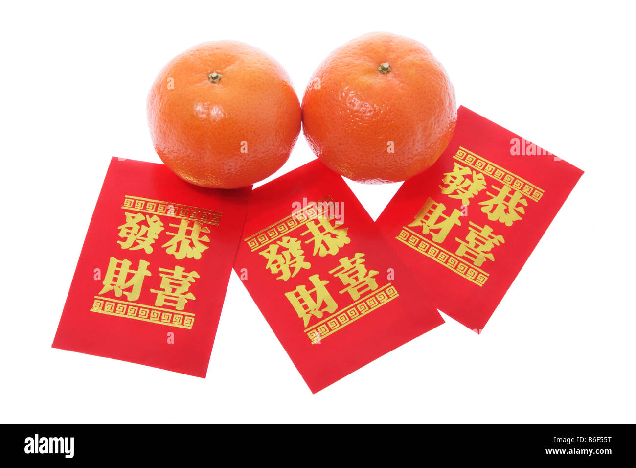 Mandarins and Red Packets Stock Photo - Alamy