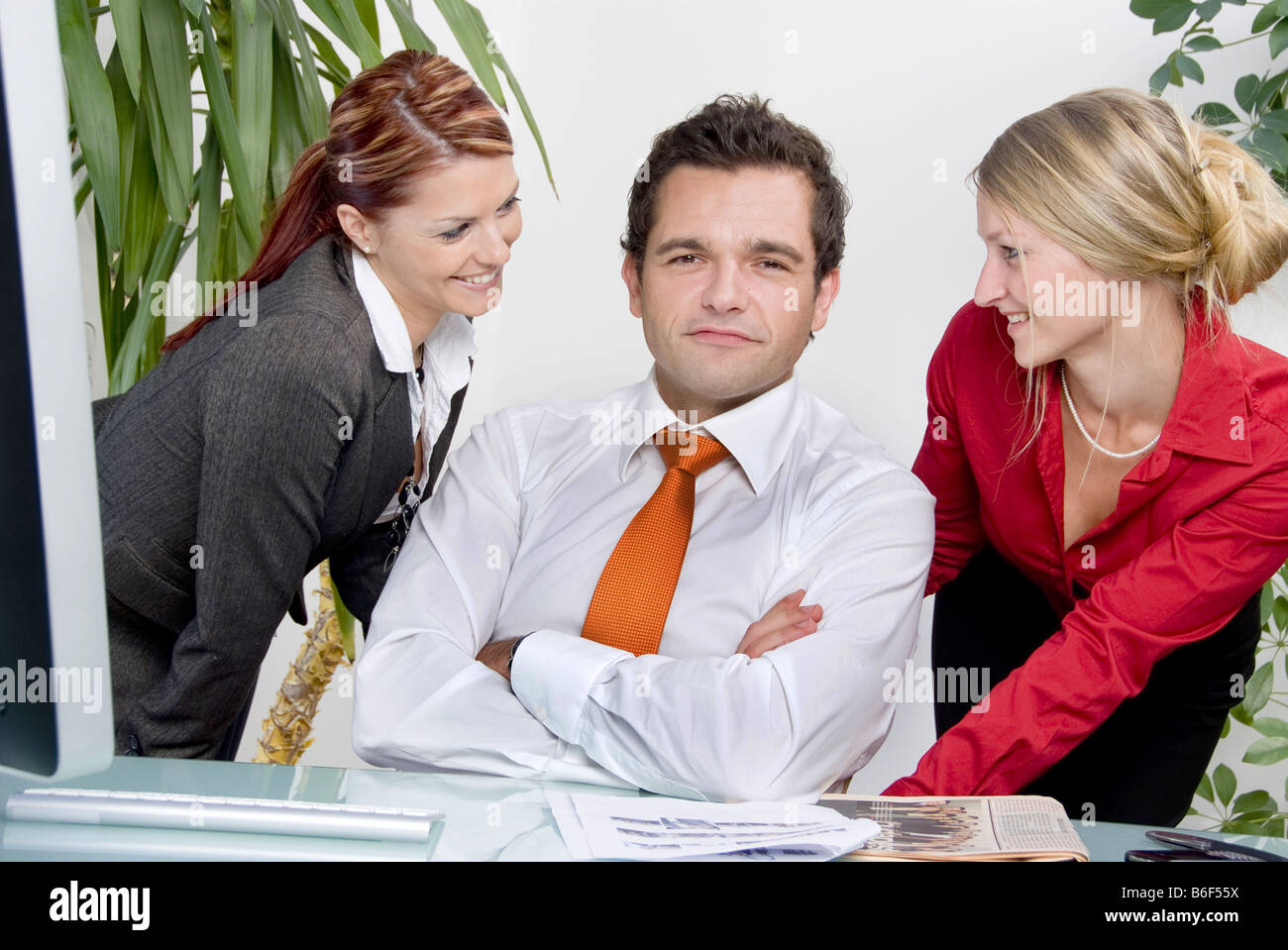 boss and two young secretaries Stock Photo - Alamy