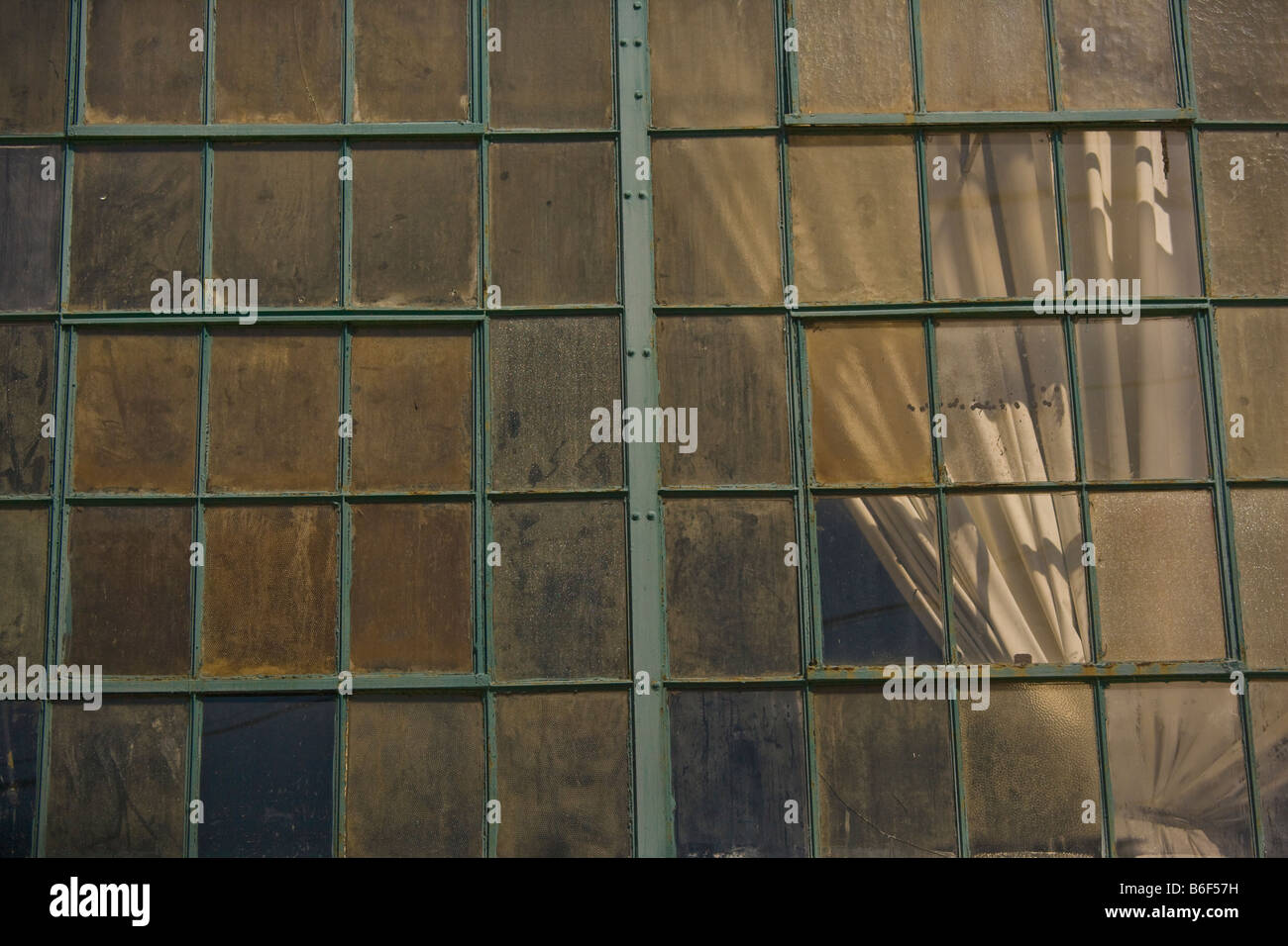 Dust covered factory window Stock Photo - Alamy